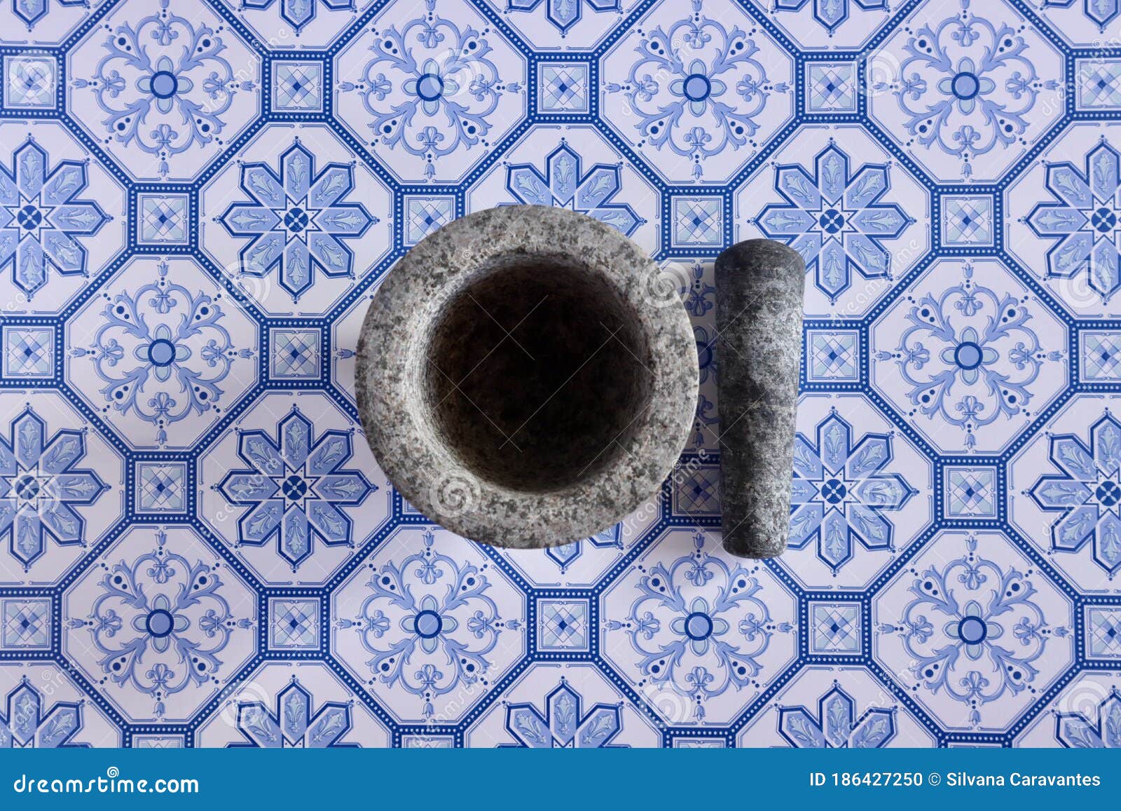 Mortar and Pestle Over Blue Tiles Stock Photo - Image of tiles, mosaic ...