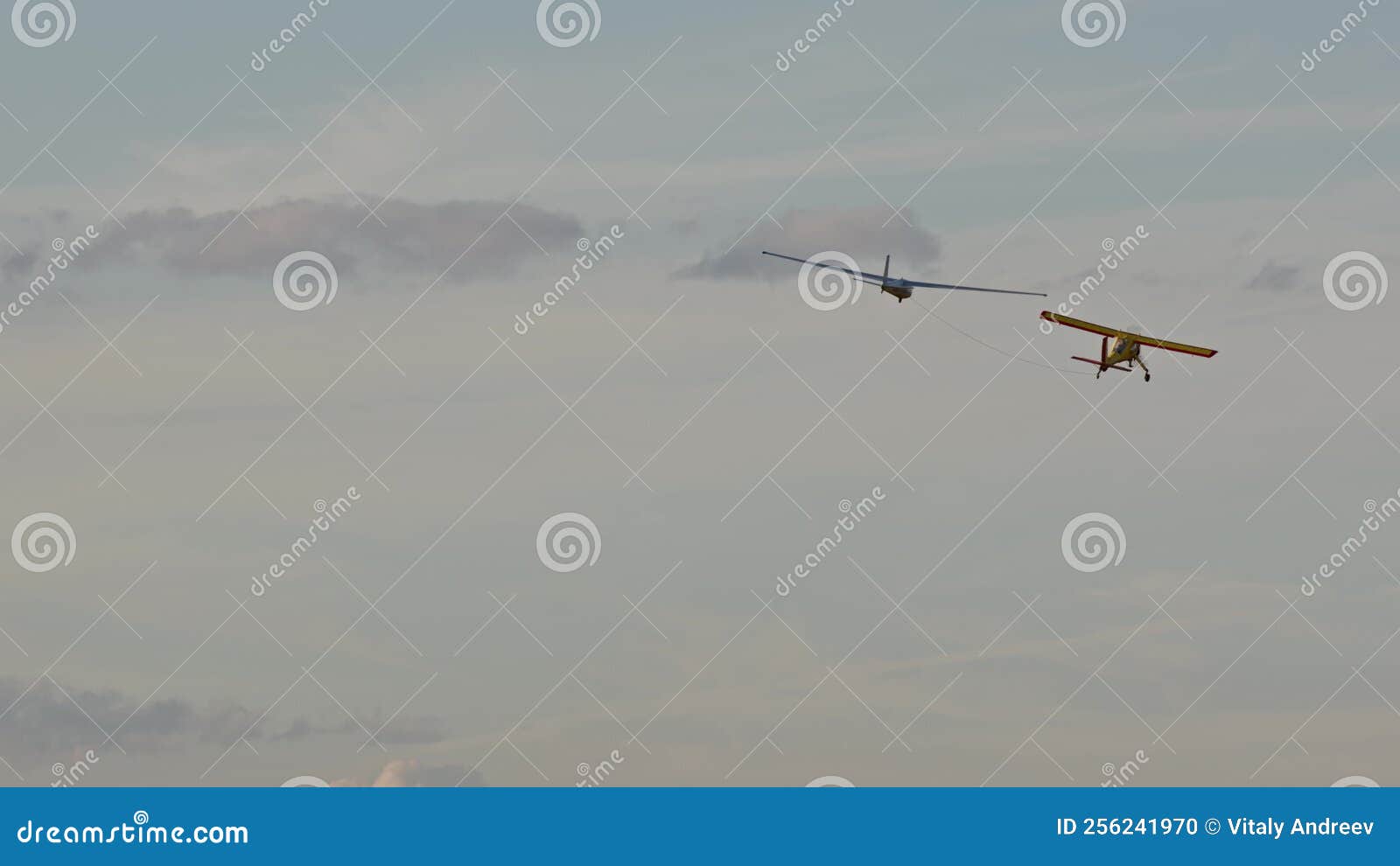 Moscow, Russia - CIRCA 2022: Bright Yellow Plane Pulls Glider on Cable ...