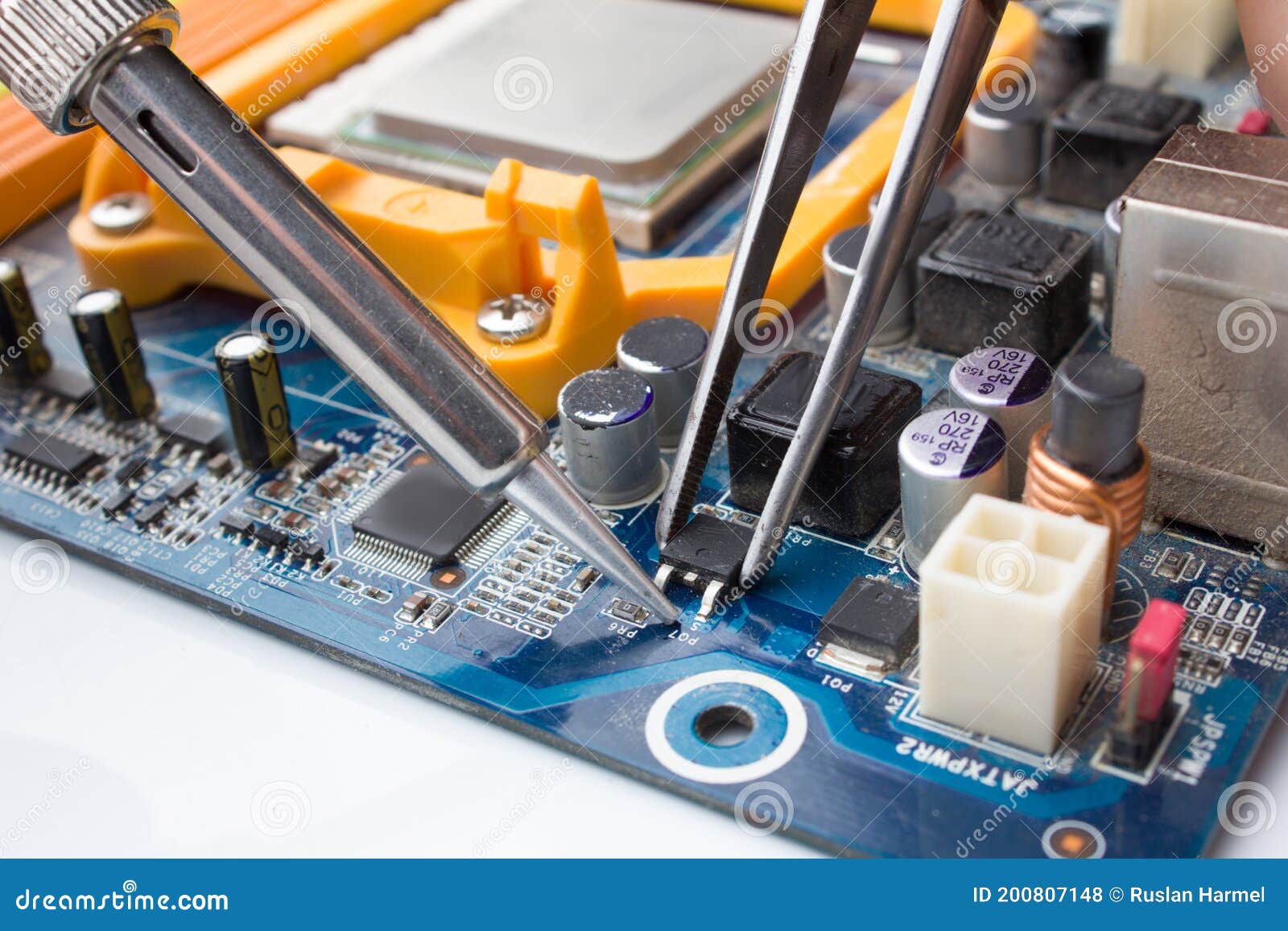 A MOSFET Transistor Key is Soldered Out of Computer Board Using a ...