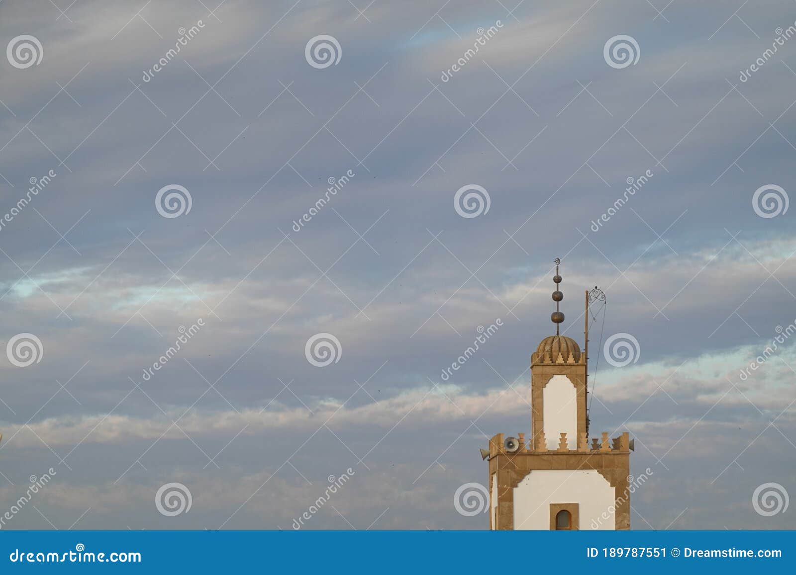 A mosk tower in a blue sky stock image. Image of marble - 189787551