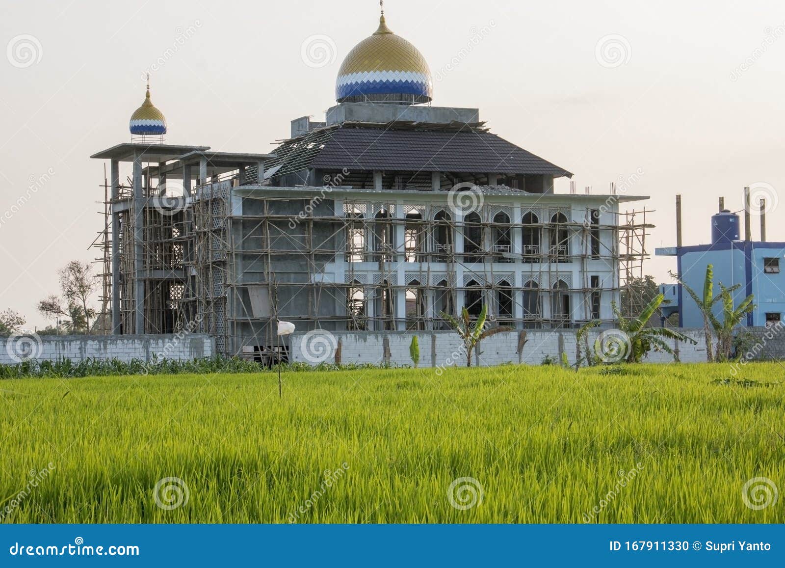Mosque Building Construction from Rice Field Stock Photo - Image of ...