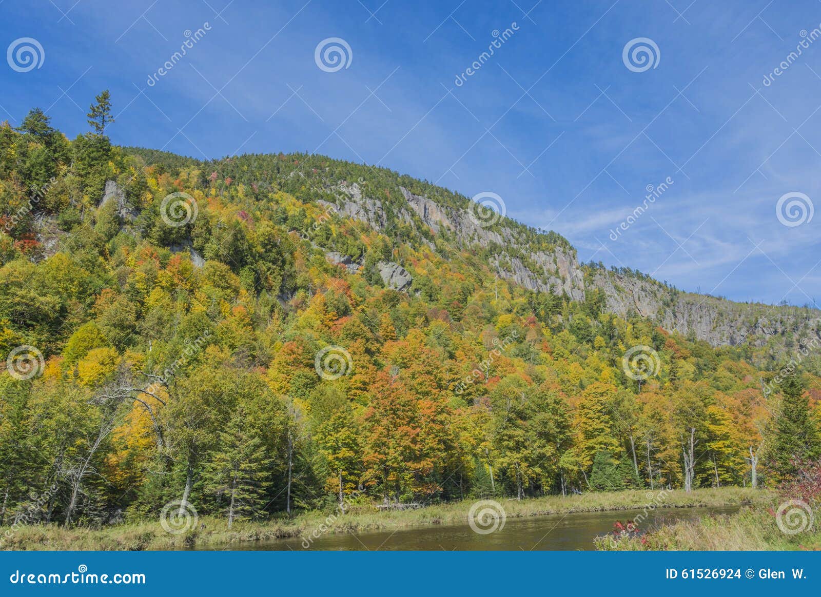 Moss Cliff with Fall Colors Stock Photo - Image of colorful, sunlight ...