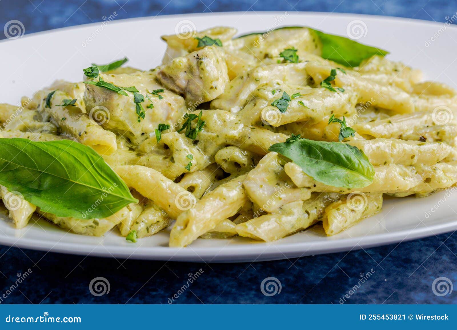 Mostaccioli Chicken Curry Pasta with Basils on a White Plate Stock ...