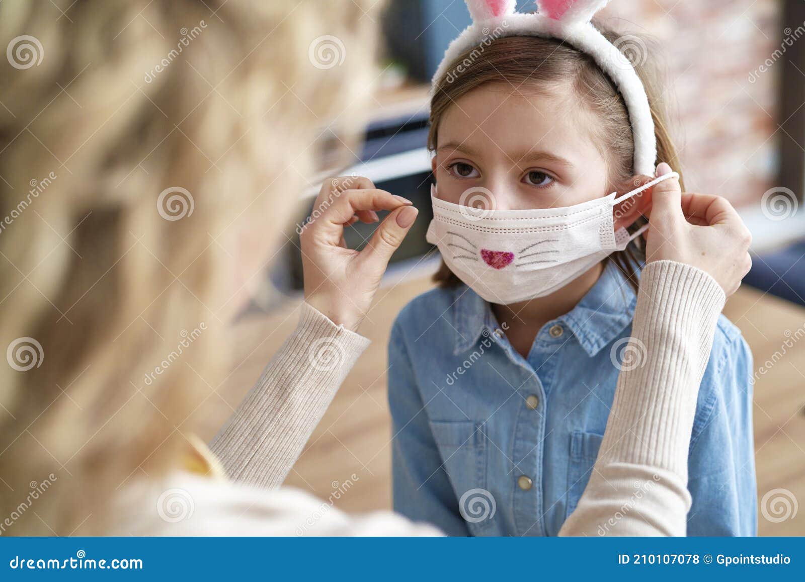 Mom Applying on a Protective Mask for Her Daughter Stock Photo - Image ...