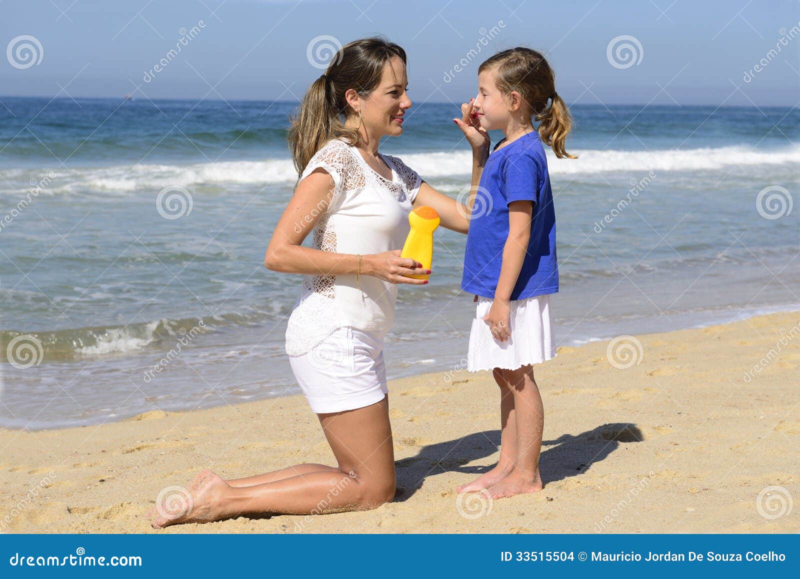 Mother applying sunscreen stock photo. Image of lifestyle - 33515504