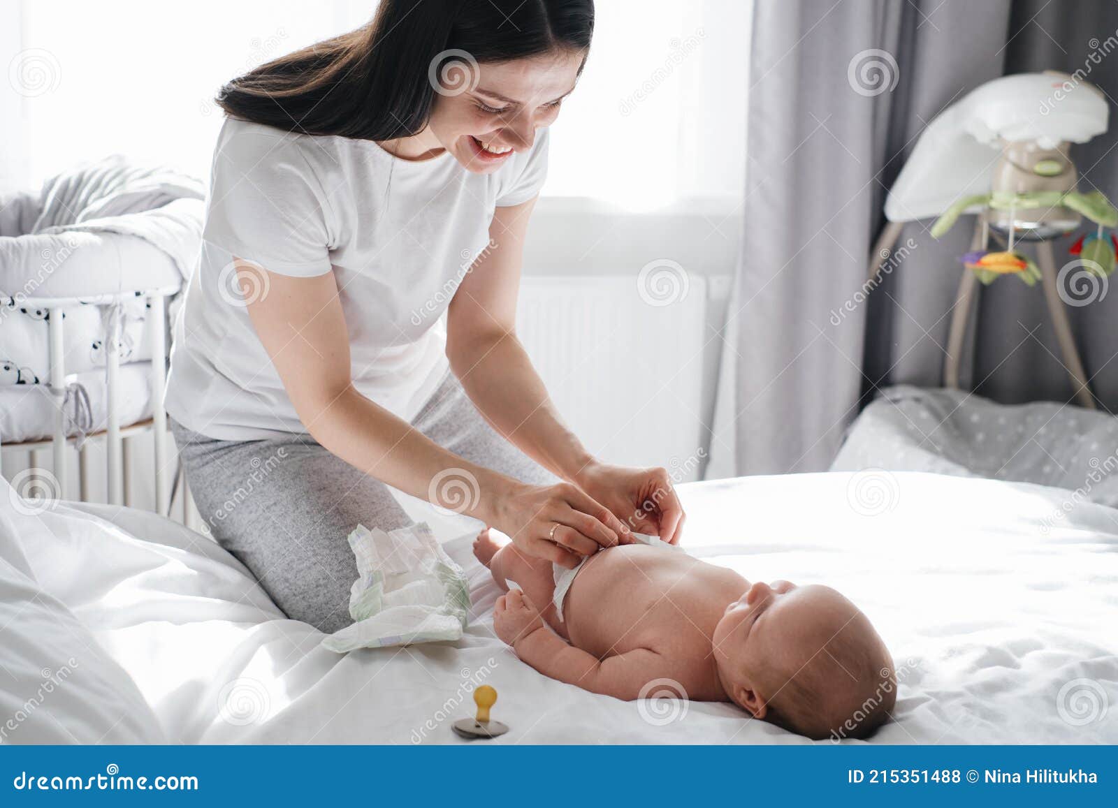 Mother and Baby Boy Changing Diaper after Sleep. Stock Photo - Image of ... Mother and Baby Boy Changing Diaper after Sleep. Stock Photo - Image of ...
