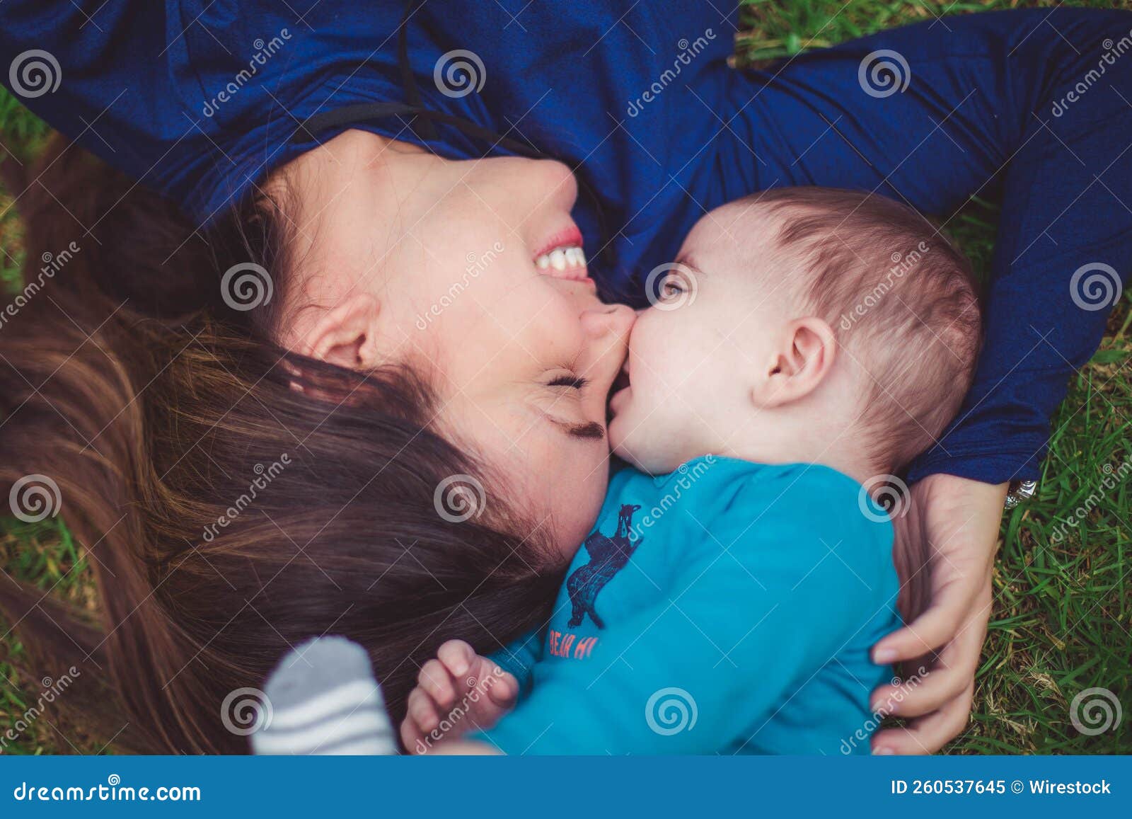 Mother with a Baby Boy Lying on Grass Stock Image - Image of lying ... Mother with a Baby Boy Lying on Grass Stock Image - Image of lying ...