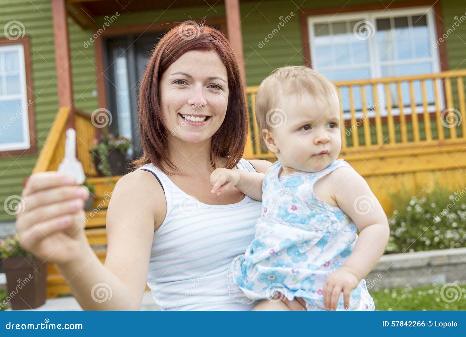 Mother and Baby in Front of the House Stock Photo - Image of faces ...