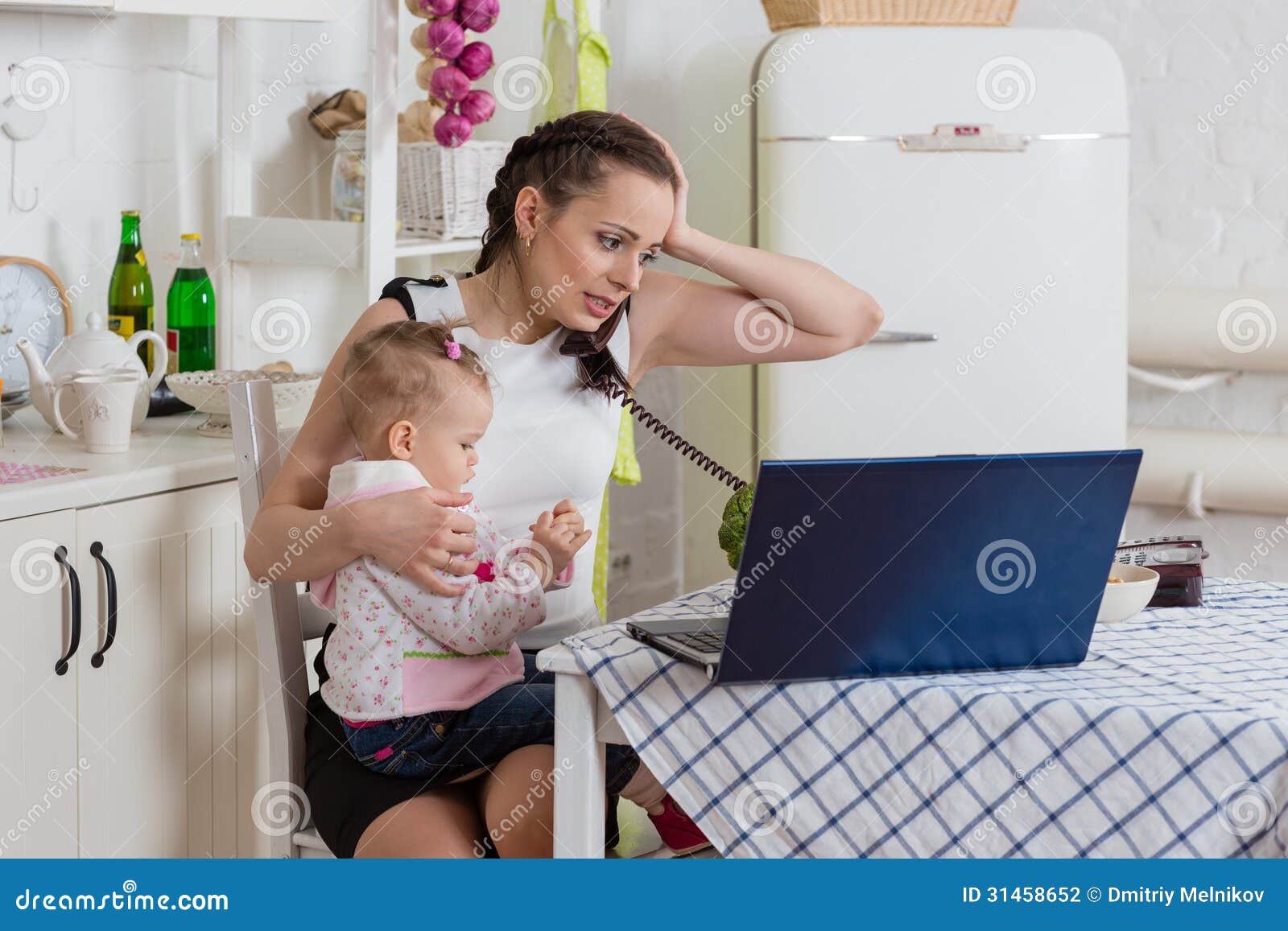 Mother with Baby in Kitchen. Stock Photo - Image of dinner, laptop ...