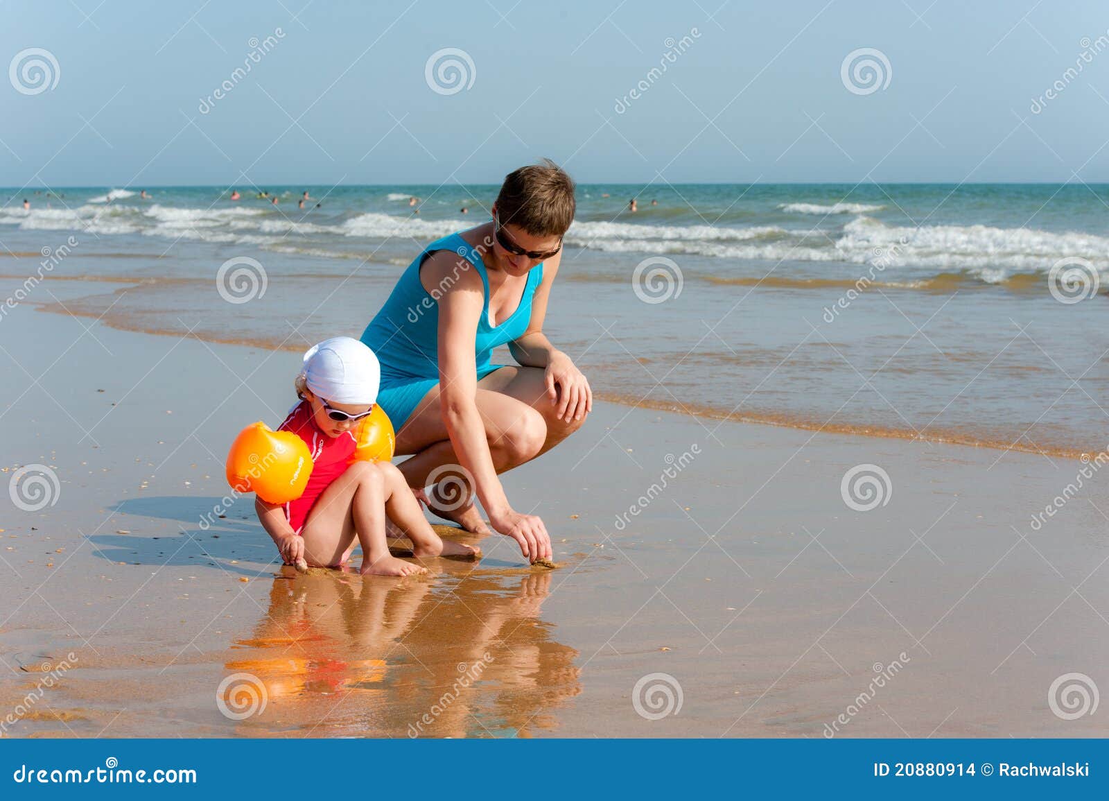 Mother and Baby are Looking for Shell Stock Photo - Image of beach ...
