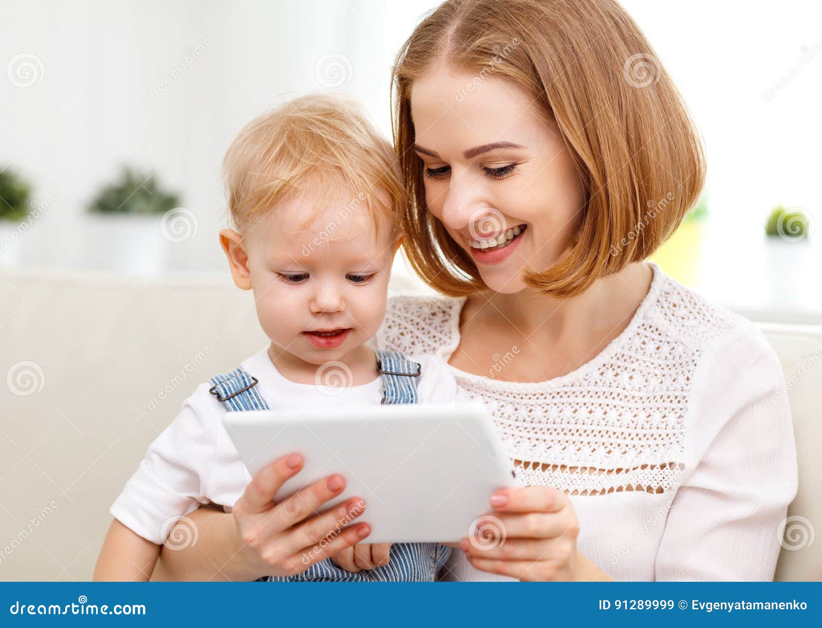 Mother and Baby Son with a Tablet Computer at Home Stock Image - Image ...