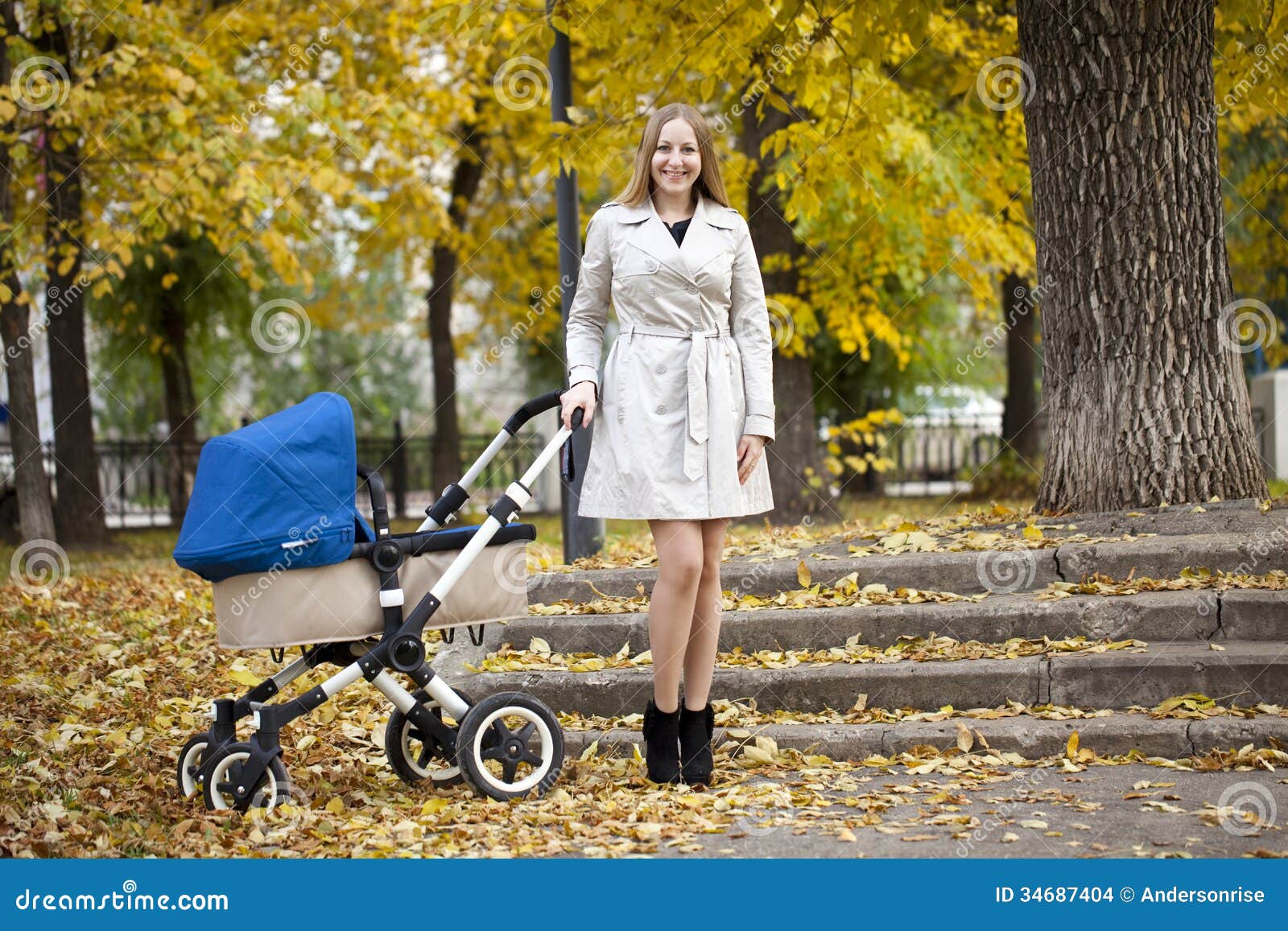 Mother with Baby Stroller for a Newborn Stock Photo - Image of child ...