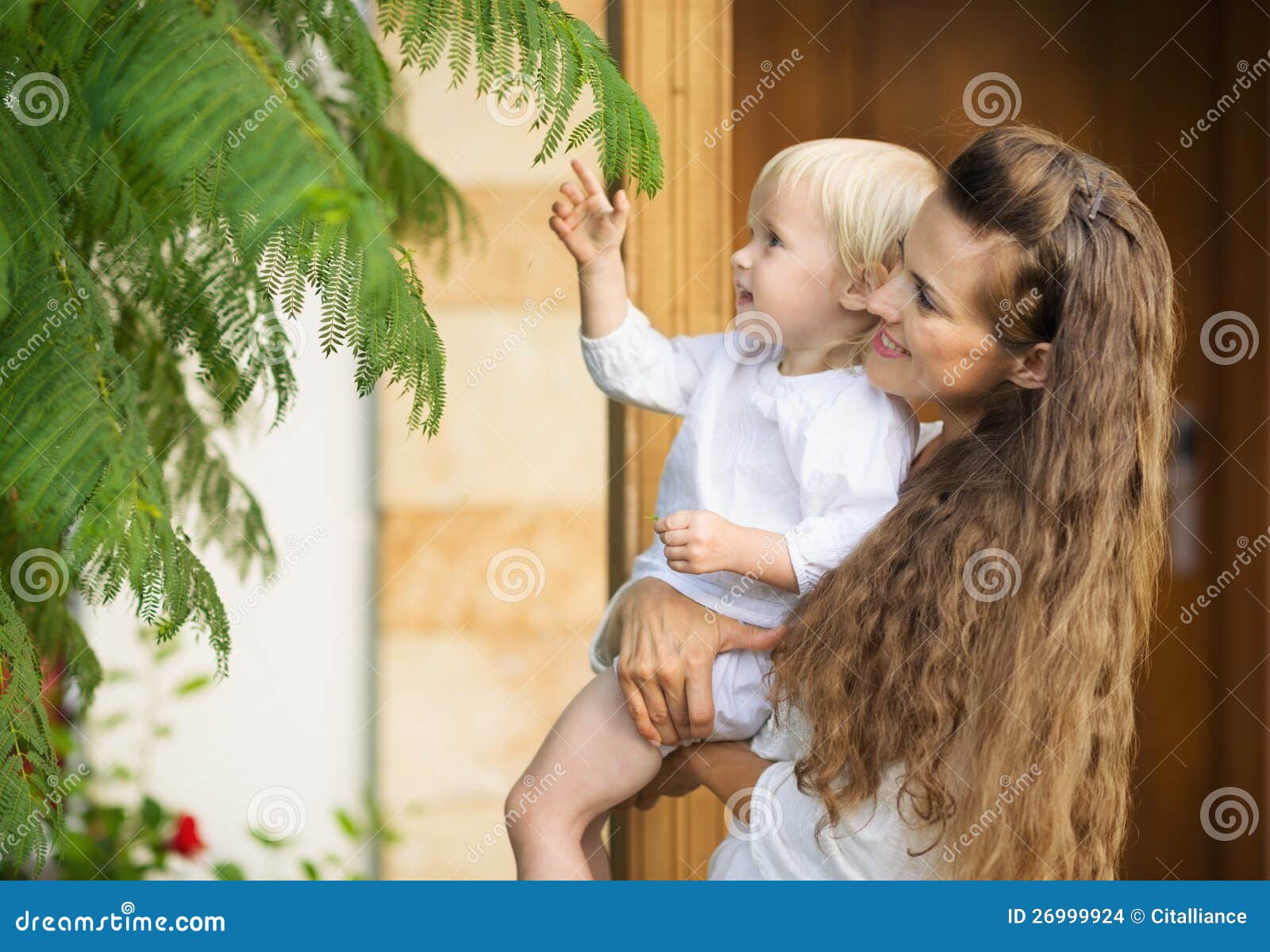 Mother and Baby Studying Plants Outdoors Stock Photo - Image of mammy ...