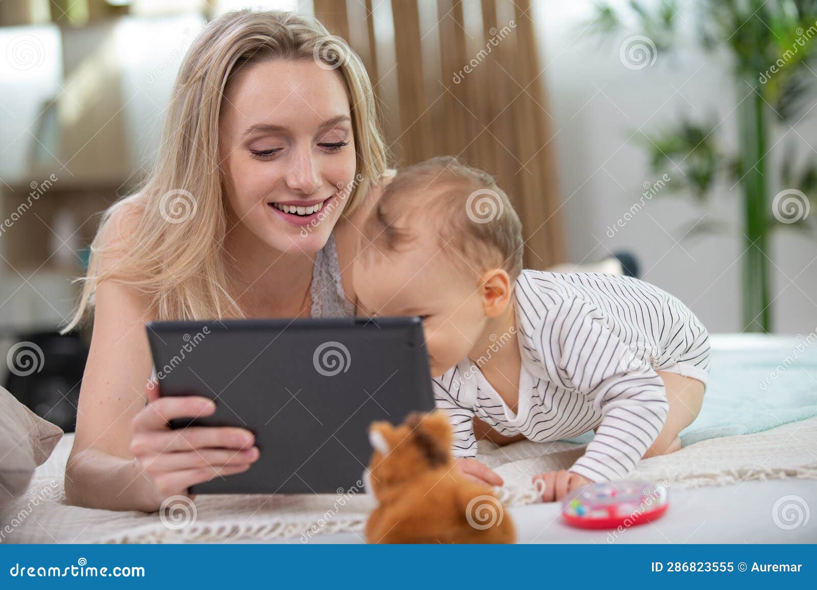 Mother and Baby Using Digital Tablet Stock Image - Image of tranquil ...