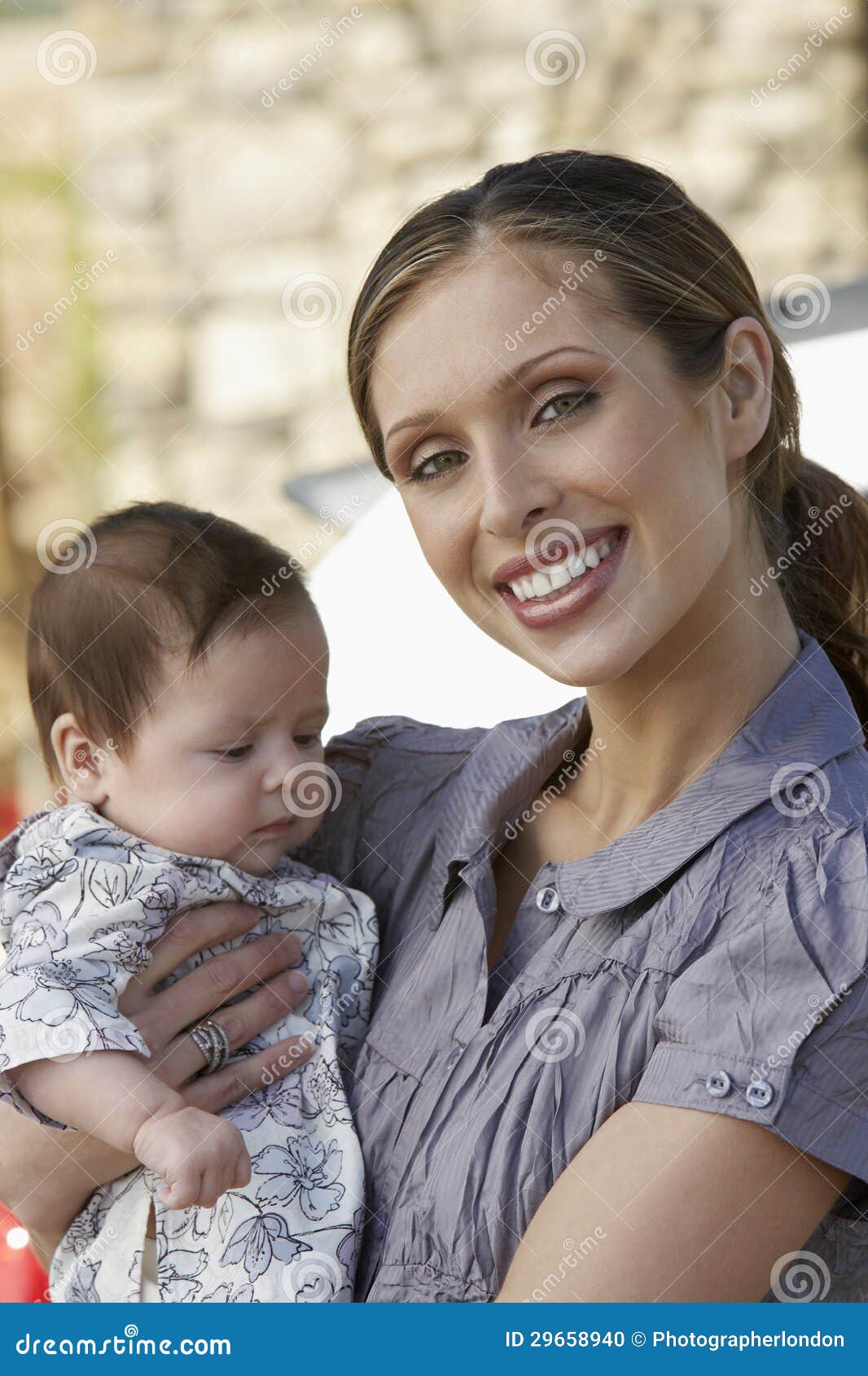 Mother Carrying Baby stock photo. Image of beauty, innocence - 29658940