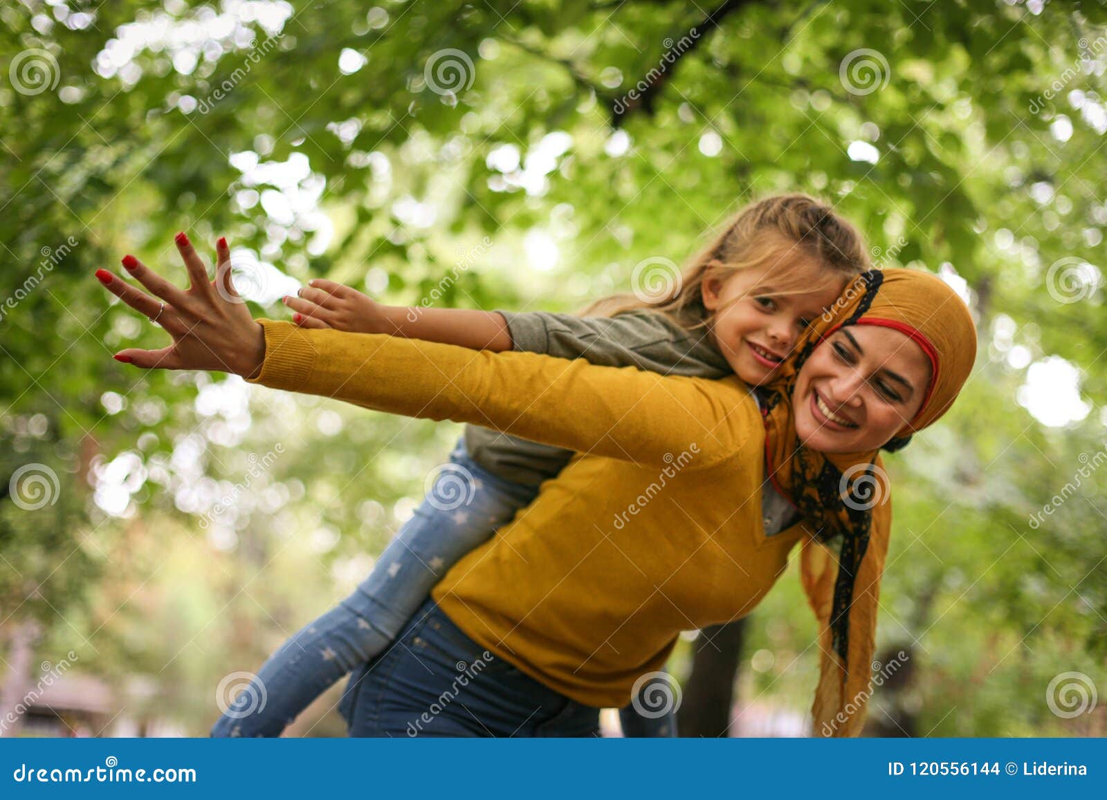 Mother Carrying Daughter on Piggyback. Stock Photo - Image of female ... Mother Carrying Daughter on Piggyback. Stock Photo - Image of female ...