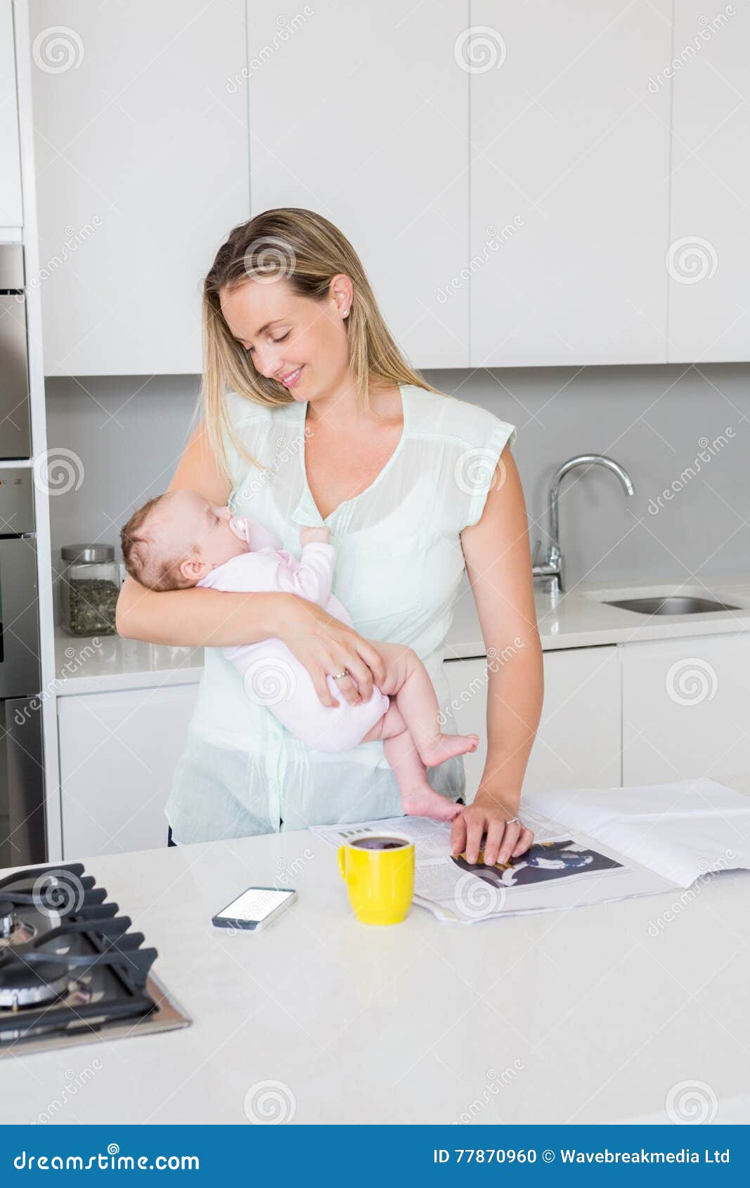 Mother Carrying Her Baby in Kitchen Stock Photo - Image of babyboy ...