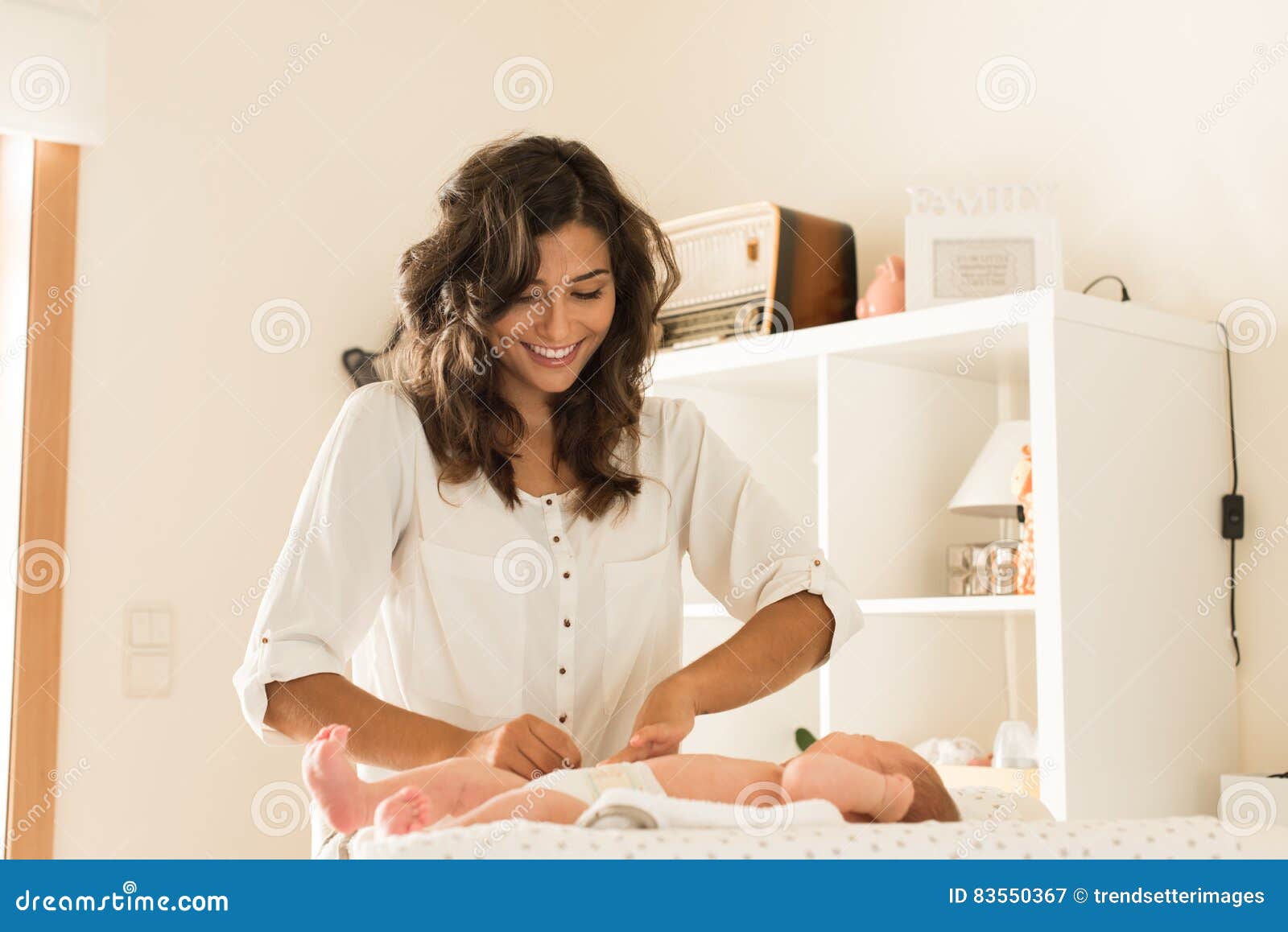 Mother Changing Baby`s Diaper Stock Image - Image of happy, child: 83550367