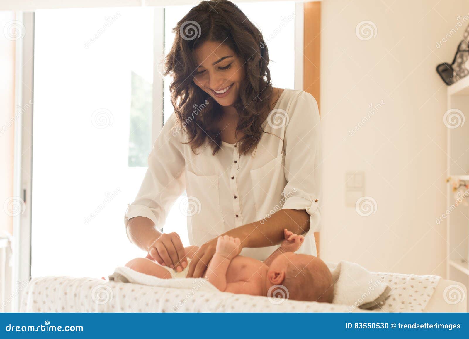 Mother Changing Baby`s Diaper Stock Photo - Image of white, skin: 83550530