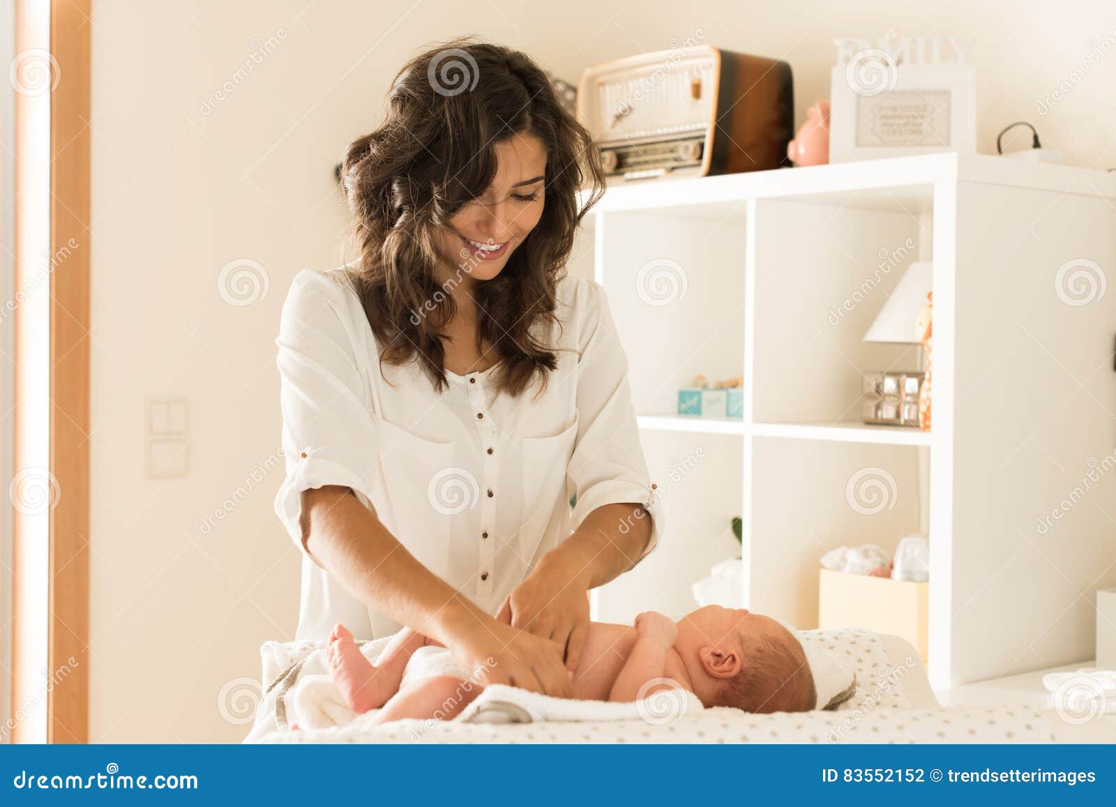 Mother Changing Nappy Stock Photo | CartoonDealer.com #15302118