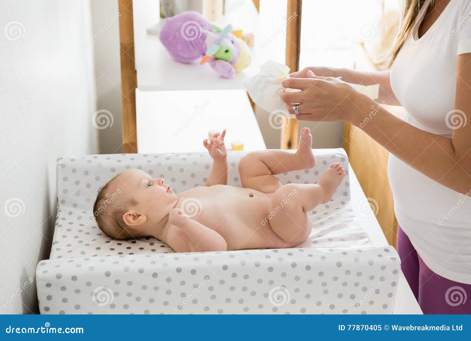 Mother Changing the Diaper of Her Baby Stock Image - Image of bear ...