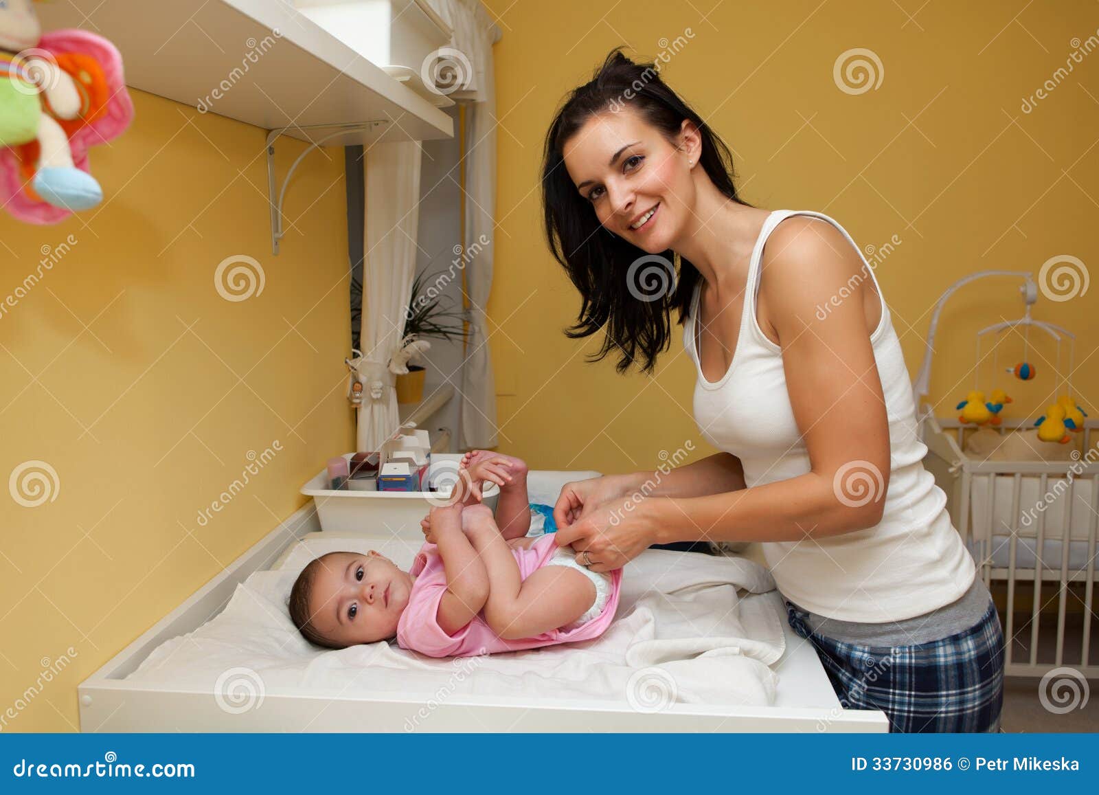 Mother Changing Baby`s Diaper Royalty-Free Stock Image | CartoonDealer ... Mother Changing Baby`s Diaper Royalty-Free Stock Image | CartoonDealer ...