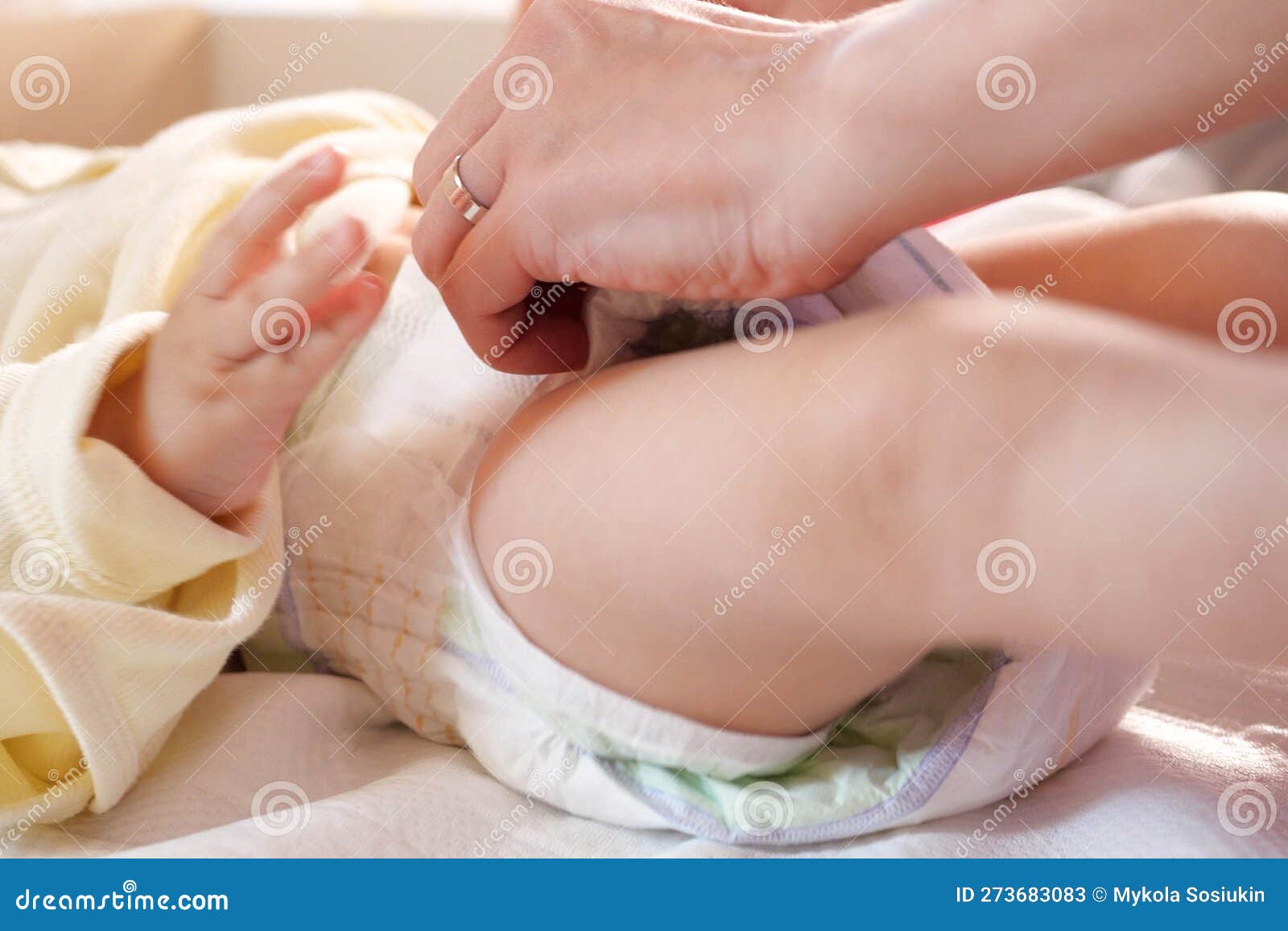 Mother Changing Her Baby Diaper on Table, Close Up Stock Image - Image of table, cute: 273683083