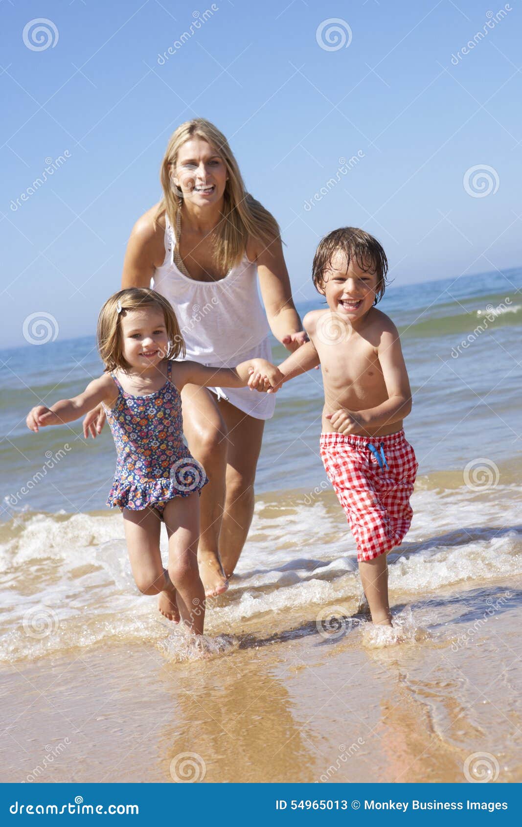 Mother Chasing Young Girl On Beach Royalty-Free Stock Photo ...