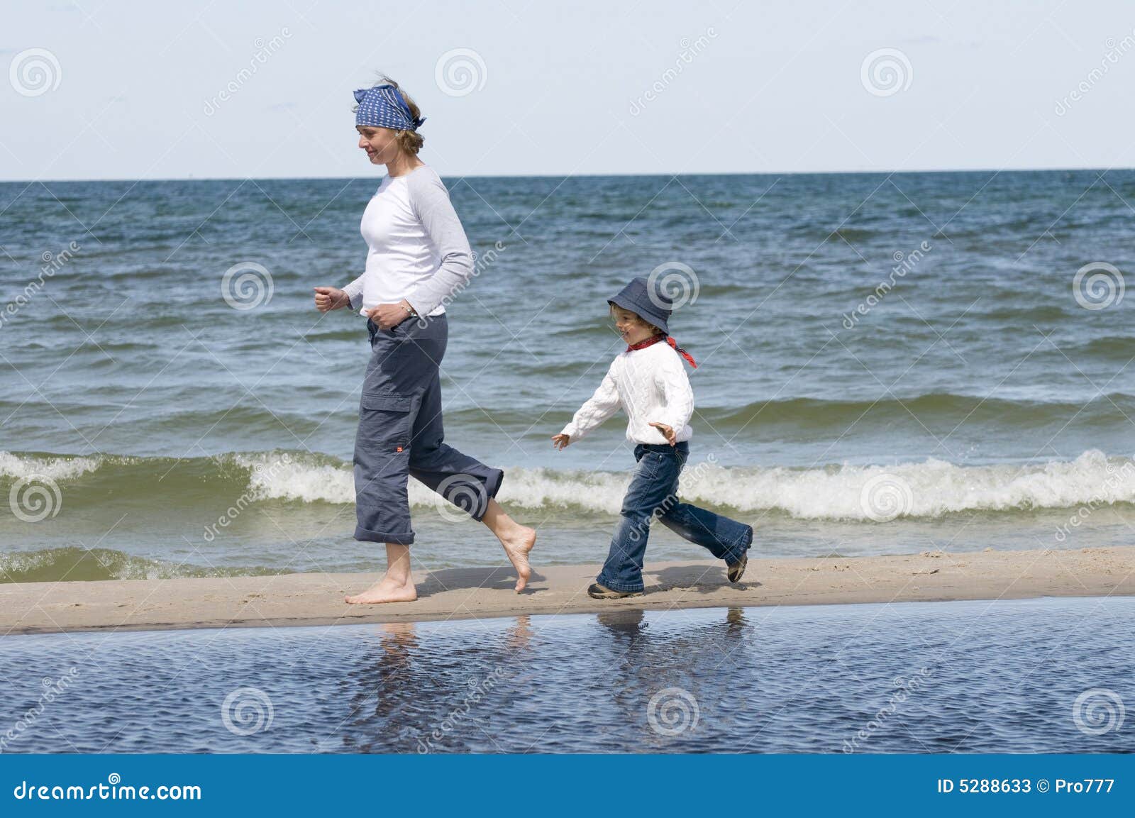 Mother Chasing Young Girl On Beach Royalty-Free Stock Photo ...