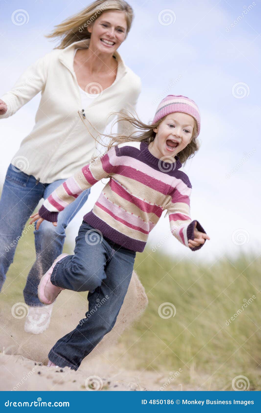 Mother Chasing Young Girl On Beach Royalty-Free Stock Photo ...