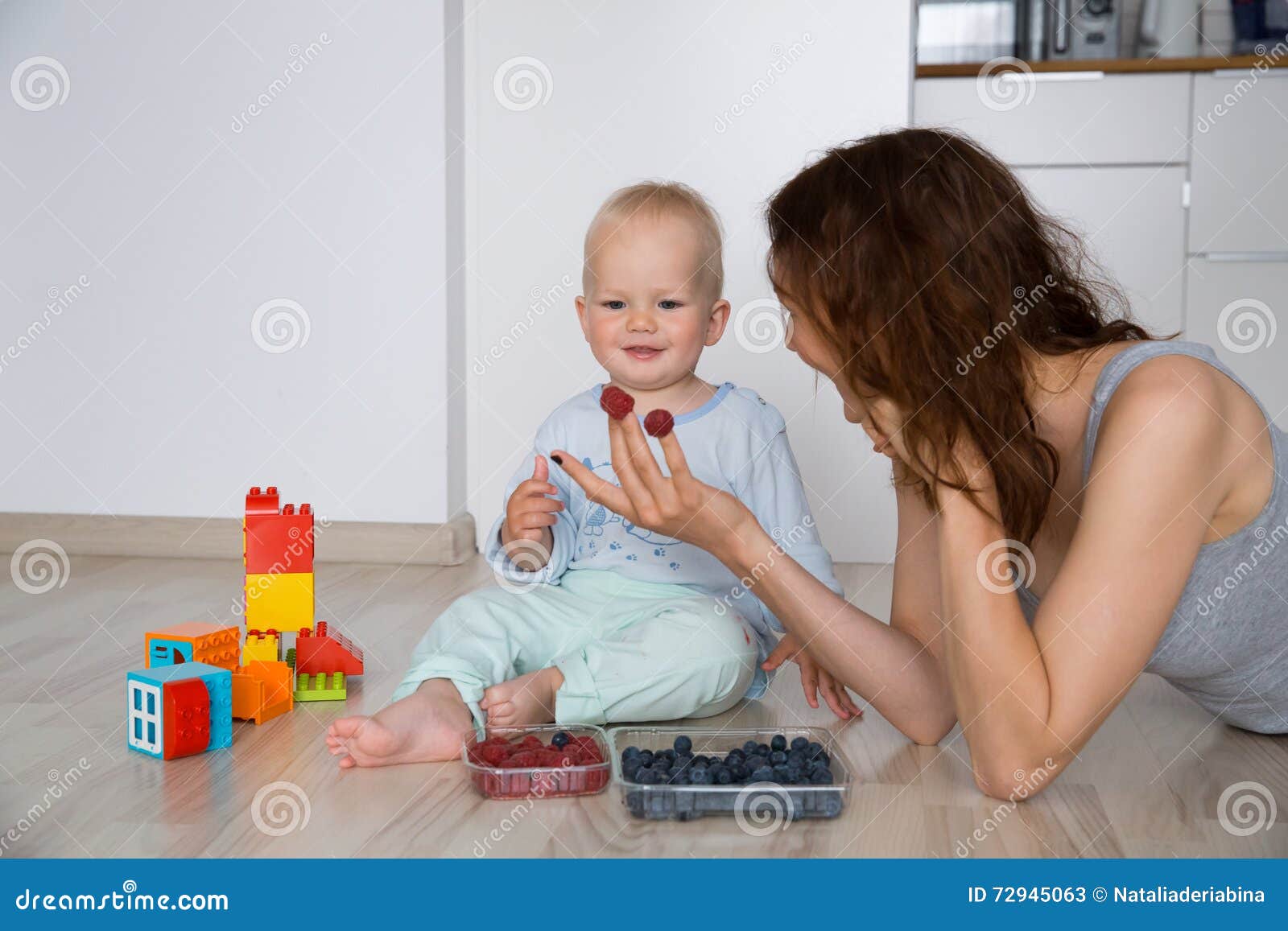 Mother and Child Eating Together Stock Image - Image of home, months ...