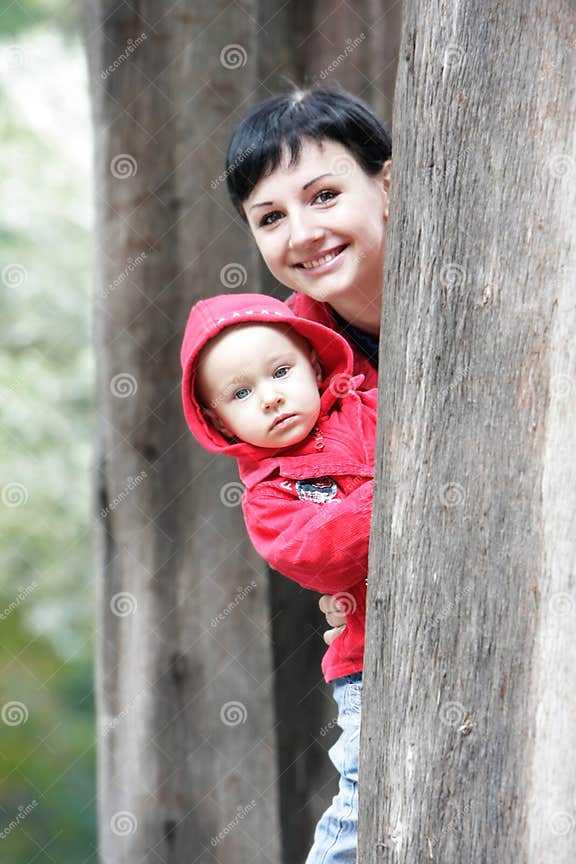 Mother and Child Looking Out from Tree Stock Photo - Image of jolly ...
