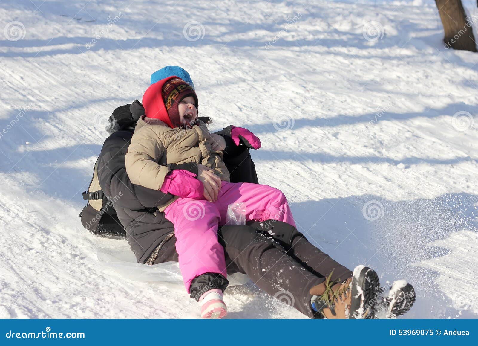 Mother and child sledging stock image. Image of bonding - 53969075
