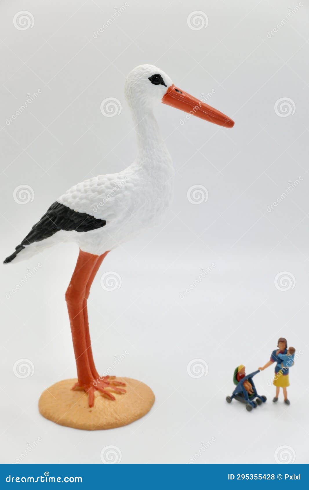 Mom with Child and a Stork Miniature Figurines Stock Photo - Image of ...