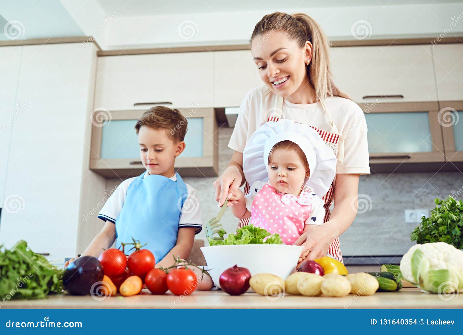 Mother and Children are Cooking in the Kitchen Stock Photo - Image of ...