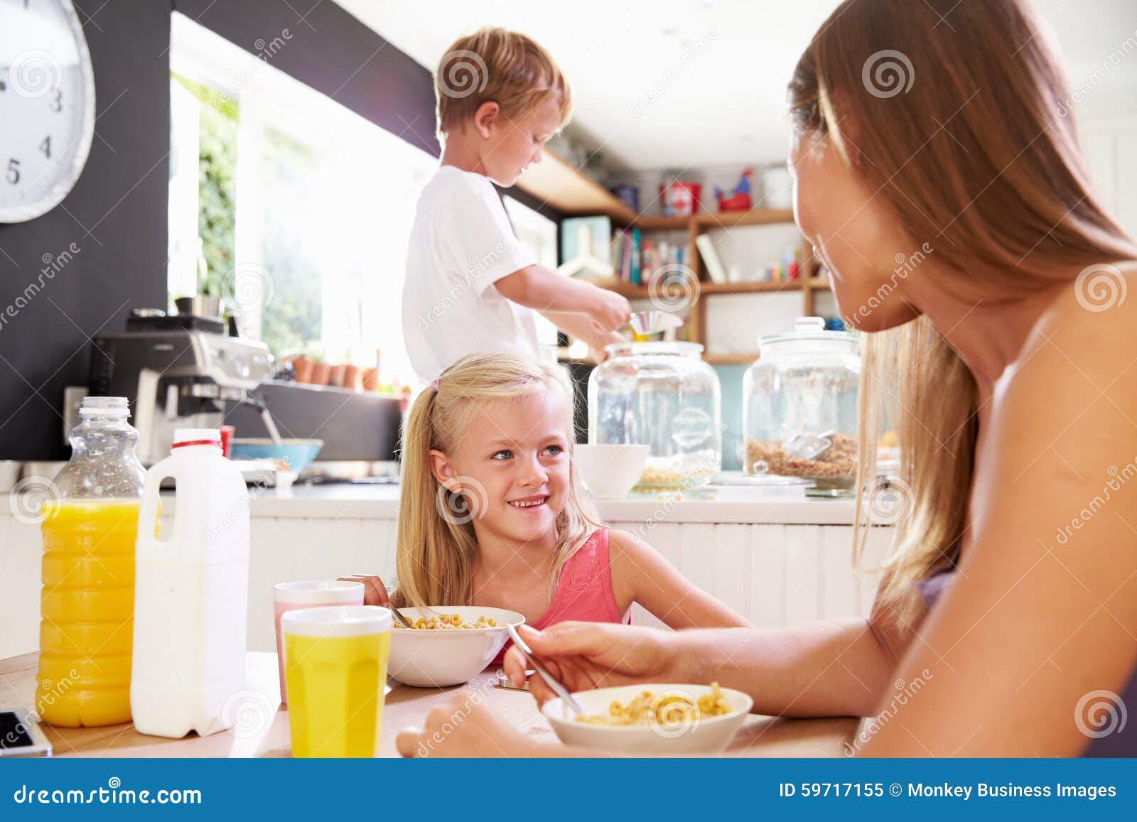 Mother and Children Having Breakfast at Kitchen Table Stock Image ...