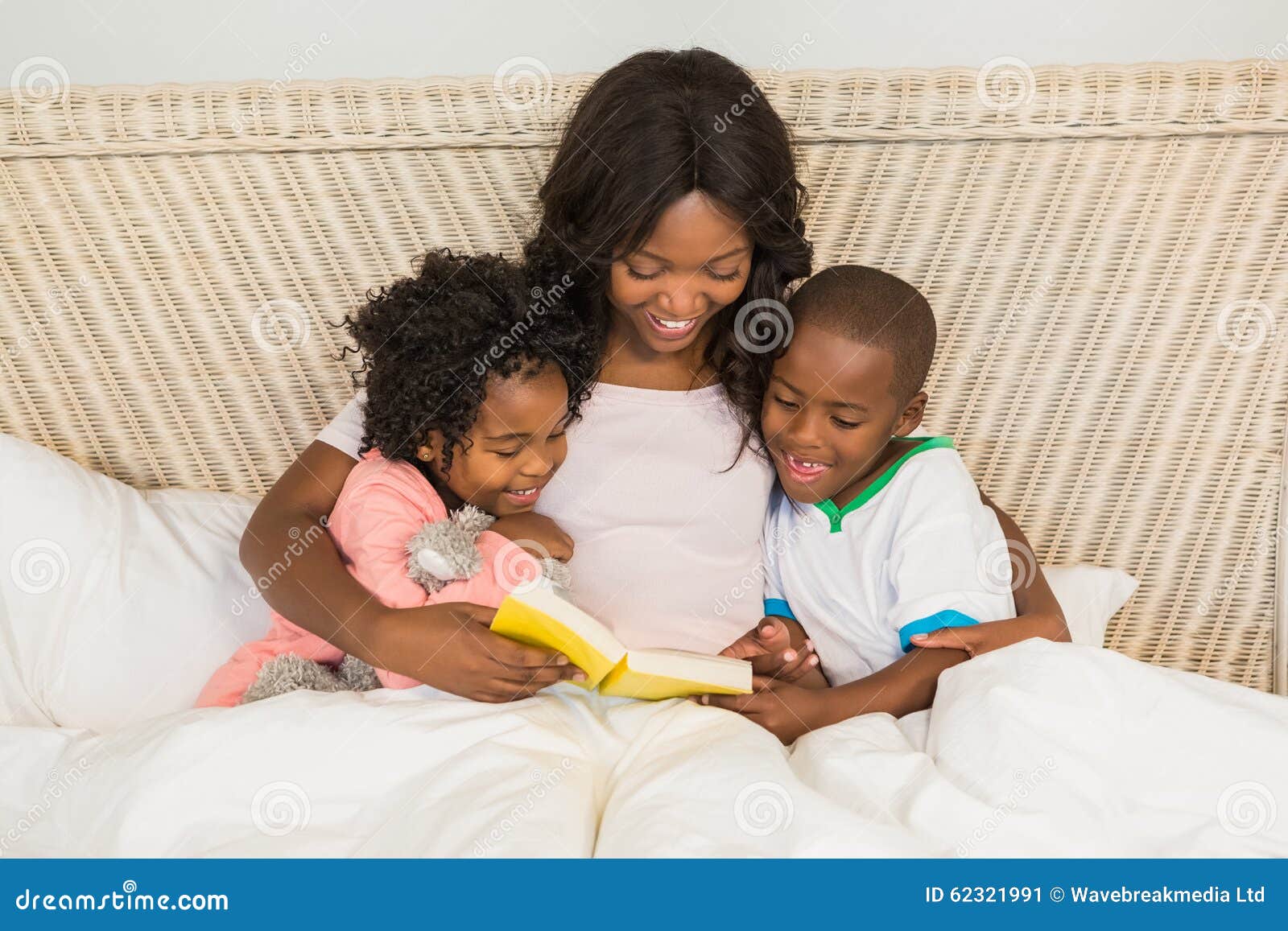Mother and Children Reading Book Together Stock Image - Image of ...