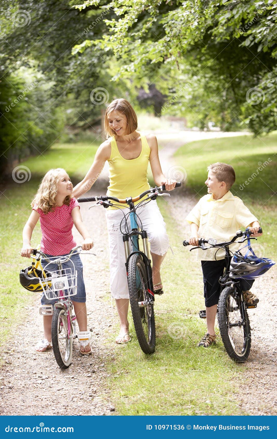 Mother and Children Riding Bikes in Countryside Stock Photo - Image of ...