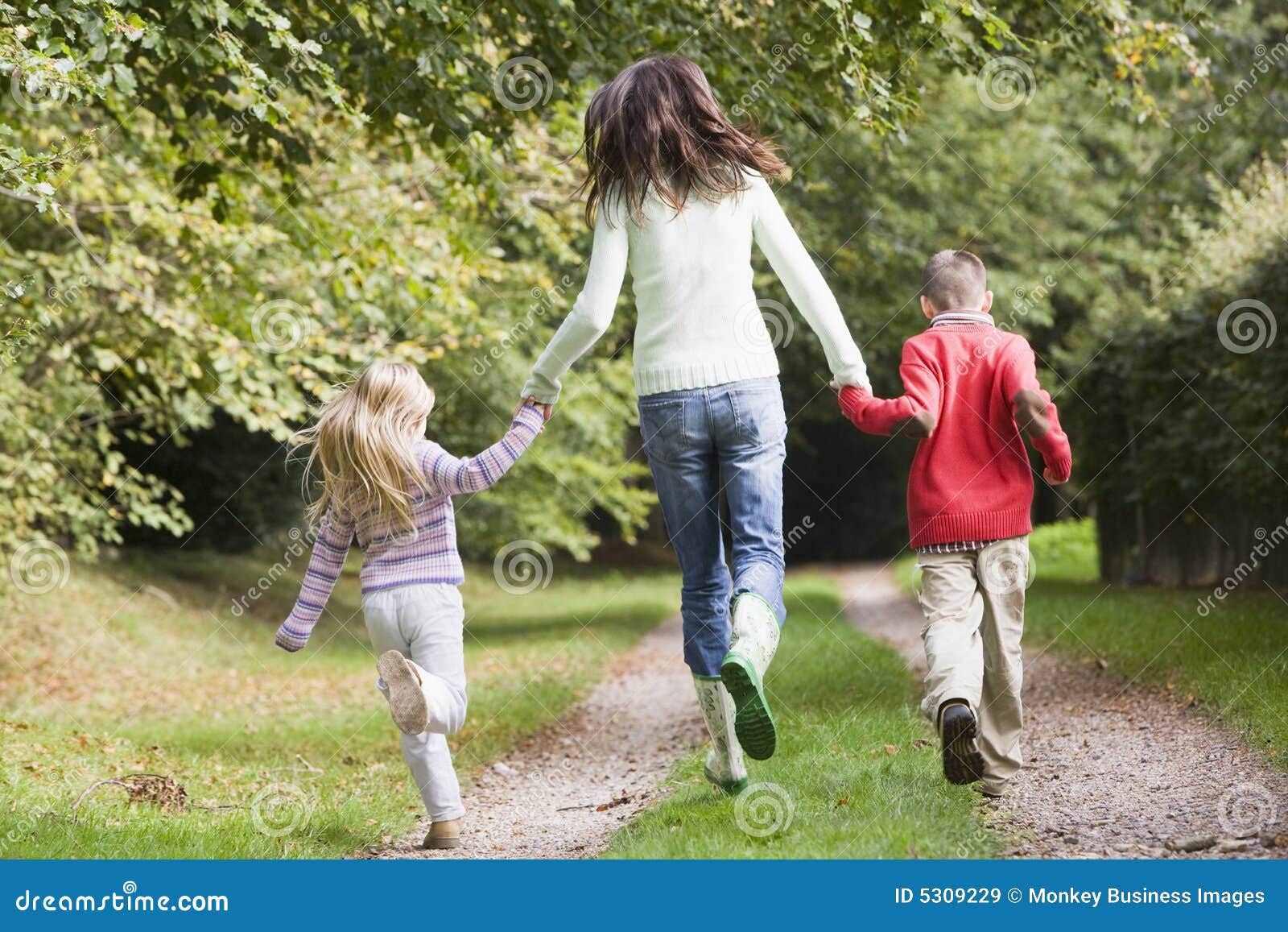 Mother and Children Running Along Woodland Path Stock Image - Image of ...