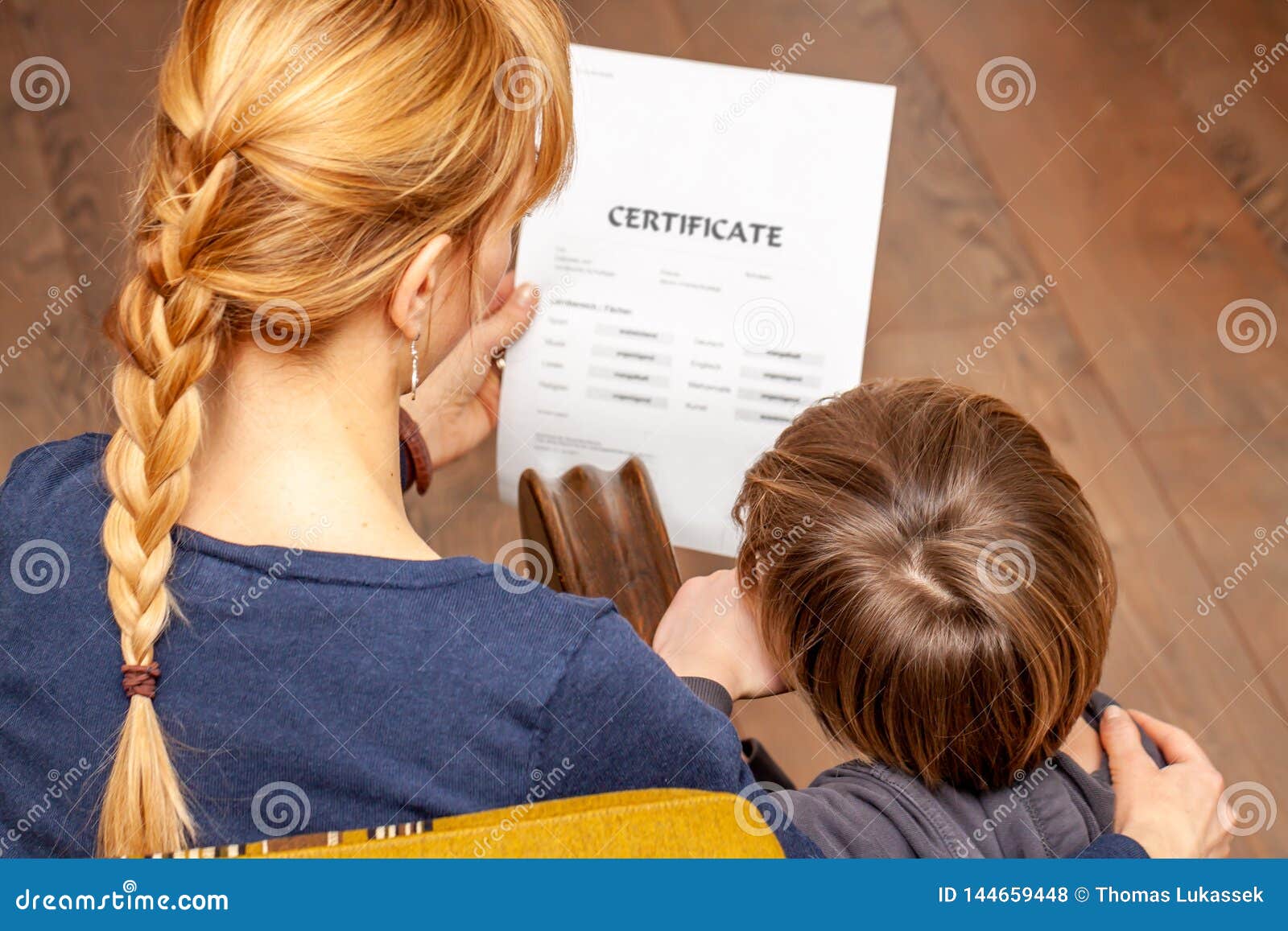 Mother Comforting Son Despite the Bad School Certificate Stock Photo ...