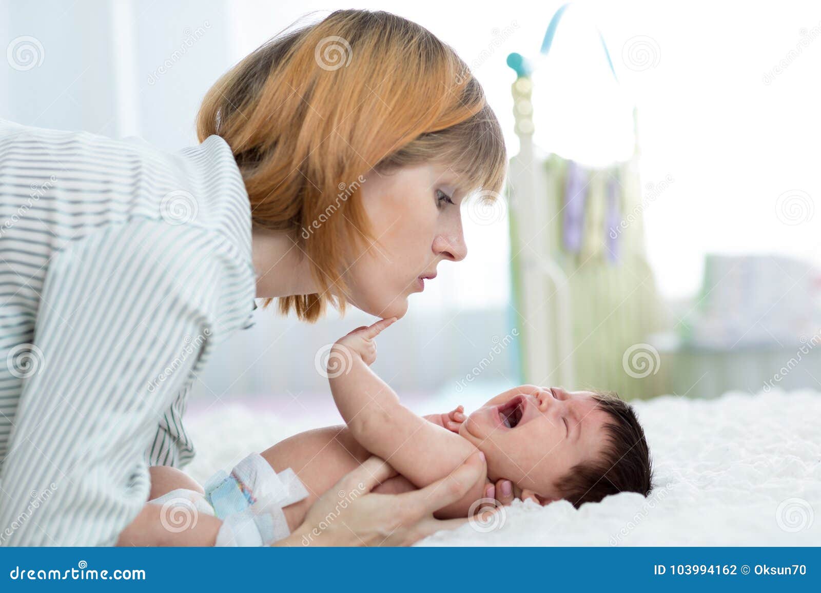 Mother Comforts Her Crying Newborn Baby Stock Photo - Image of child ...