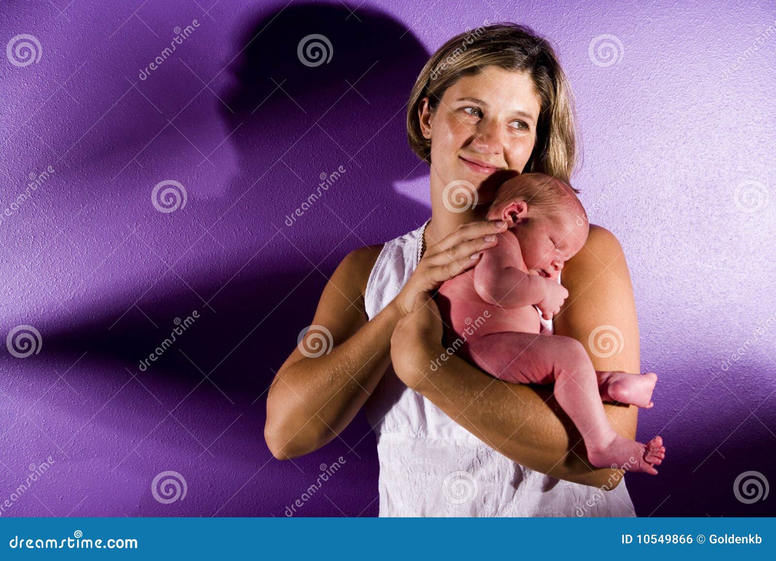 Mother cradling newborn stock photo. Image of indoors - 10549866