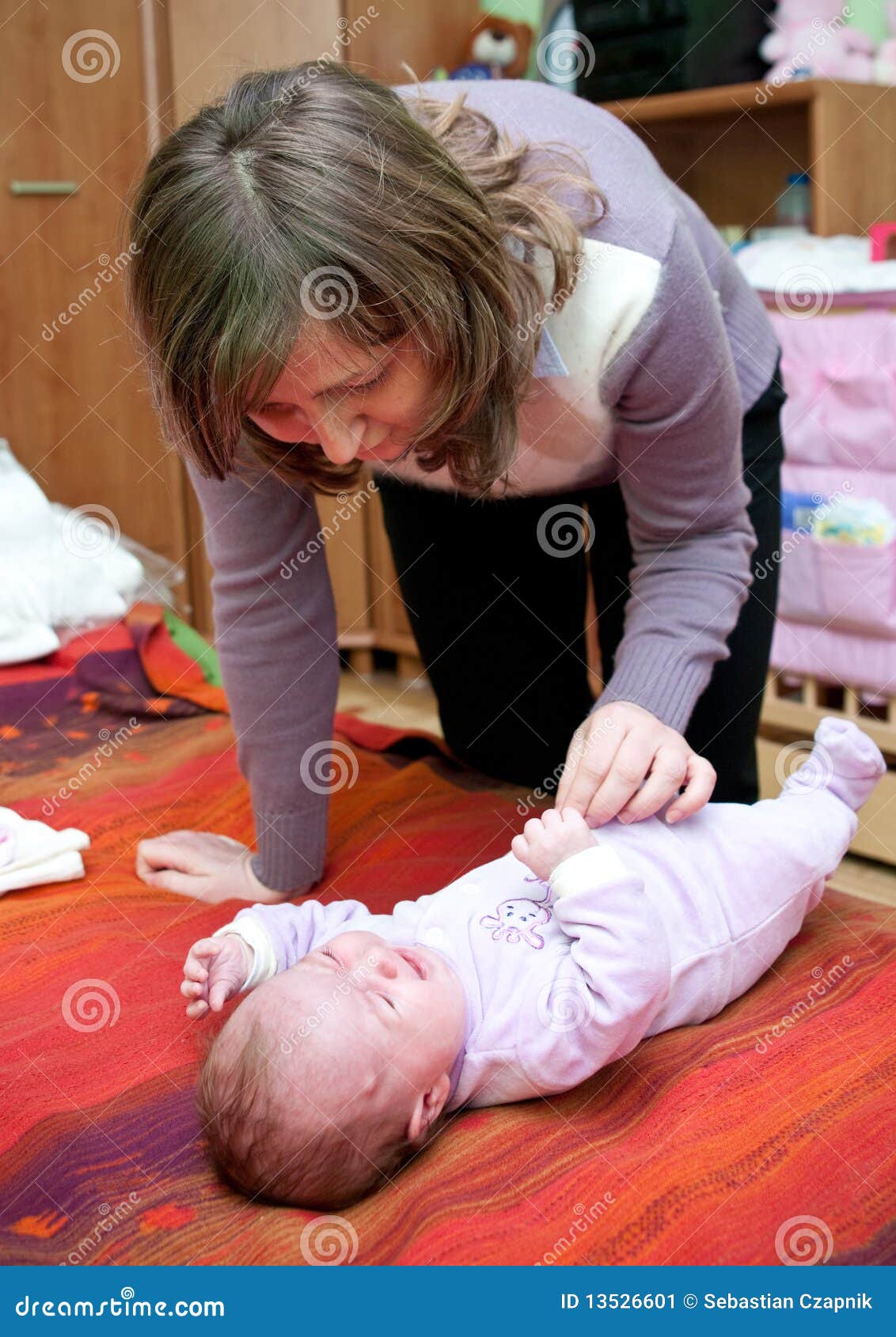 Mother with crying baby stock image. Image of mother - 13526601