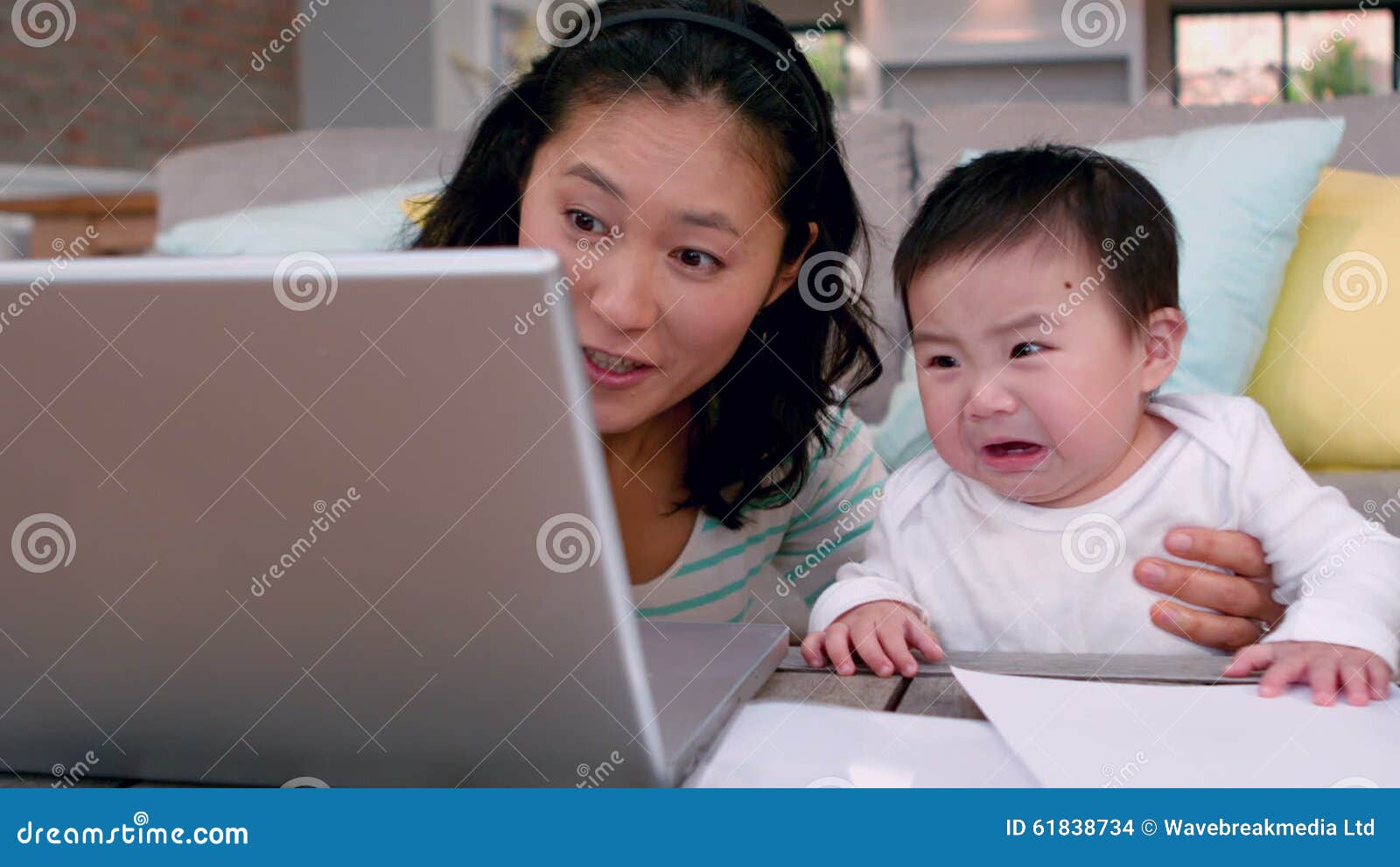 Mother with Crying Baby Using Laptop Stock Footage - Video of adult ...