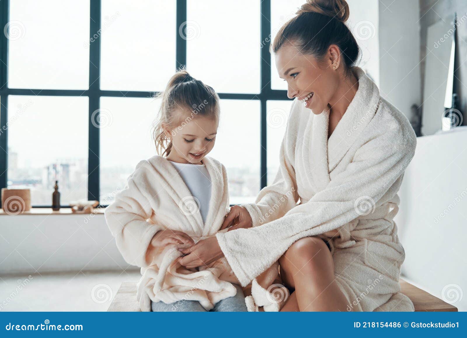 Mother with Daughter in Bathrobes Smiling Stock Photo - Image of health ...