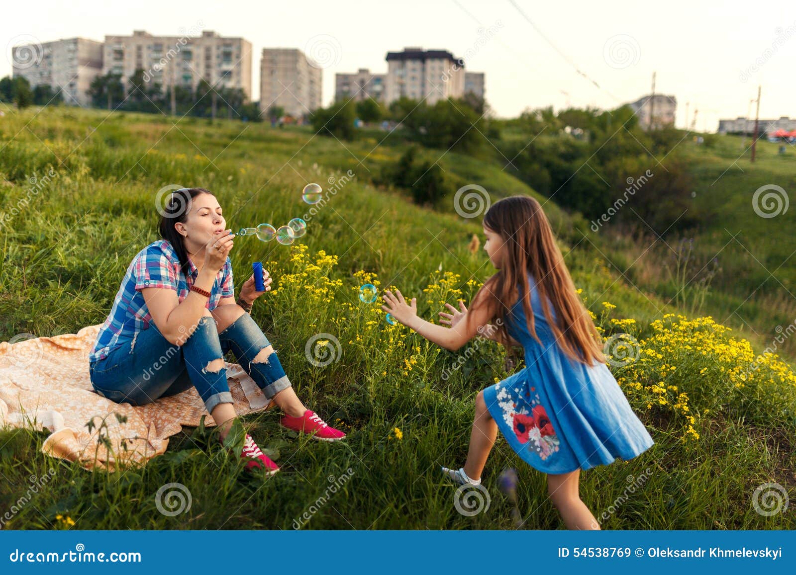 Mother and Daughter Blowing Soap Bubbles Stock Image - Image of blonde ...