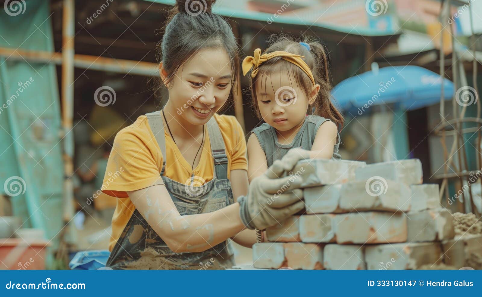 Mother and Daughter Build Wall with Bricks at Construction Site ...