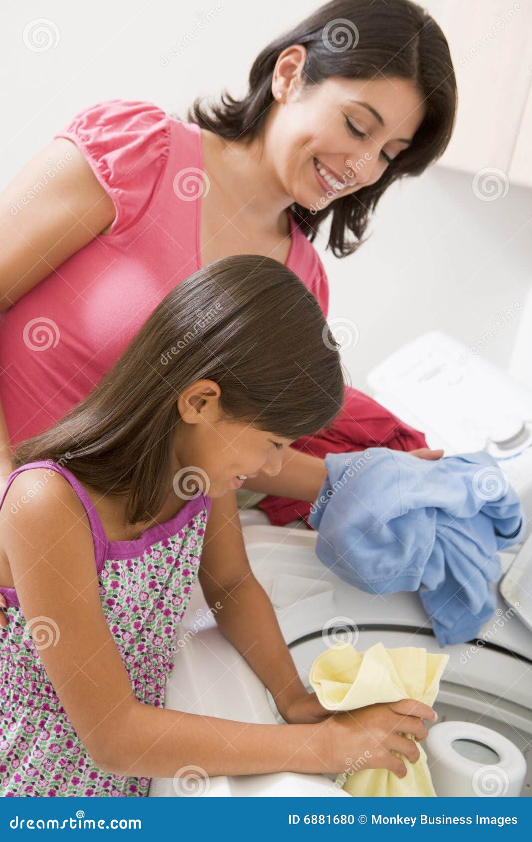 Mother and Daughter Doing Laundry Stock Photo - Image of cheerful ...