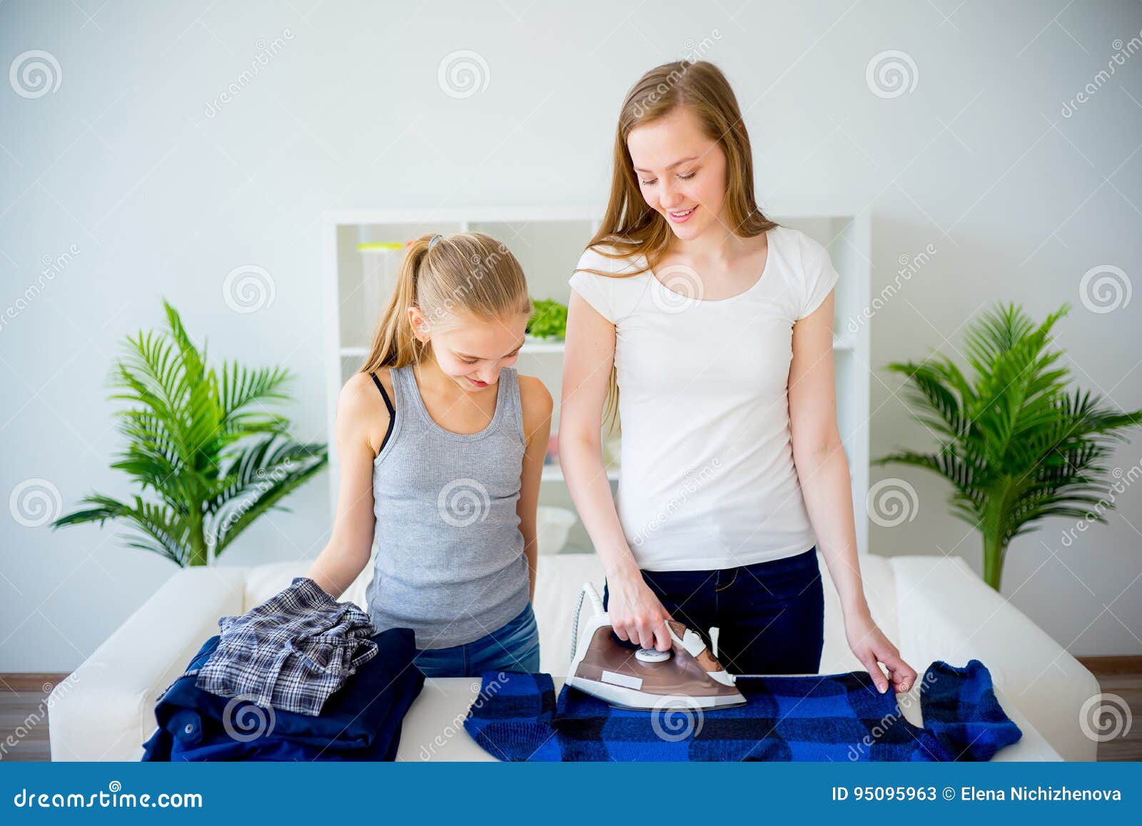 Mother and Daughter Doing Laundry Stock Image - Image of holding, iron ...