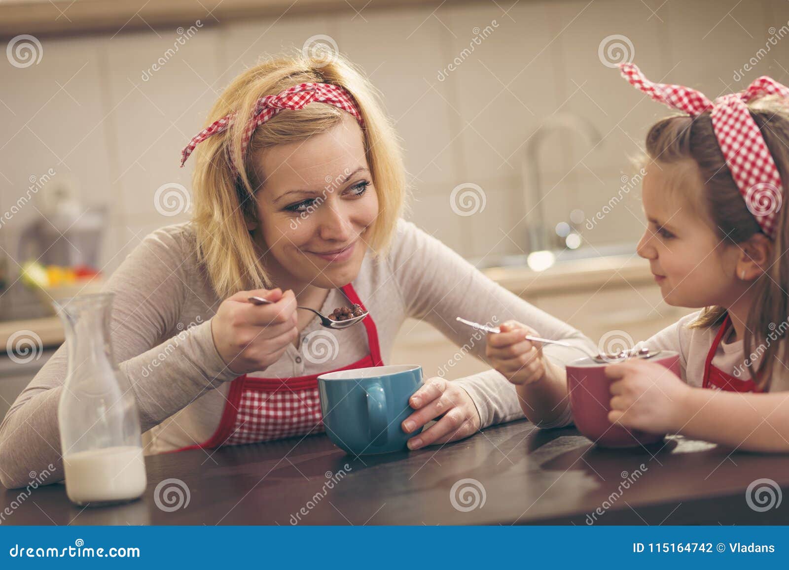 Mother and Daughter Eating Cereal Stock Photo - Image of diary, leisure ...